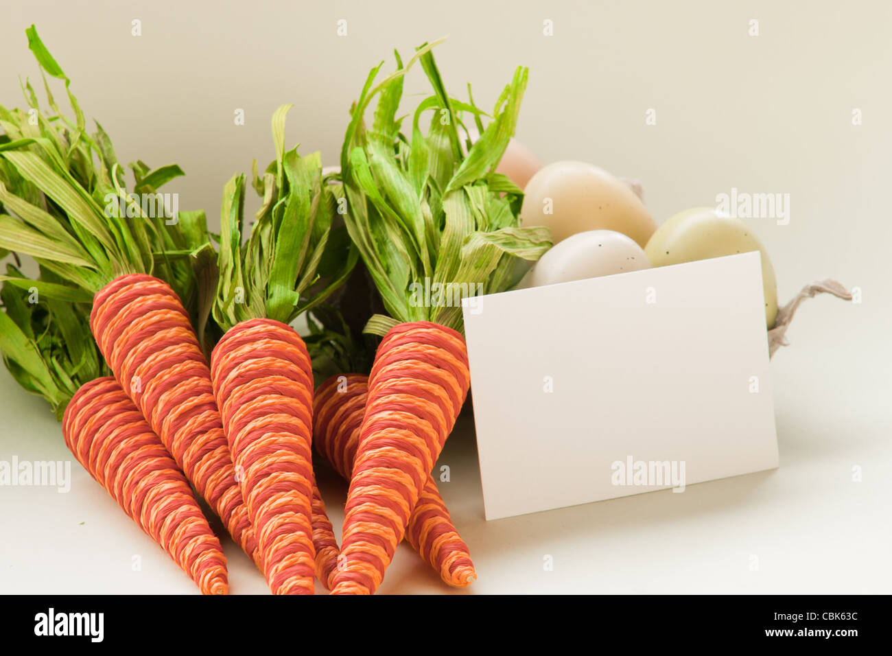 Spring carrots and painted easter eggs Stock Photo - Alamy