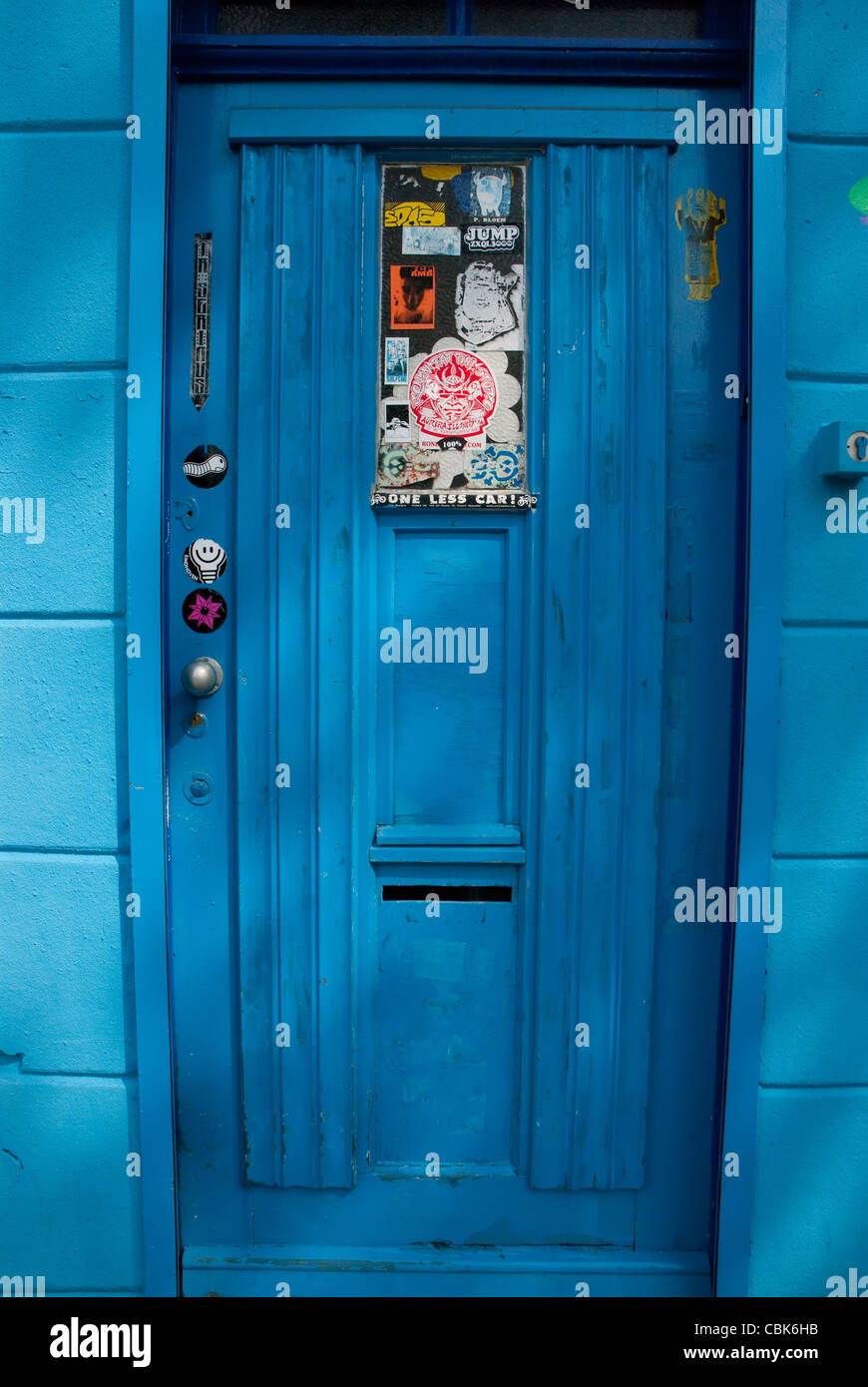Badges on a very blue door Stock Photo - Alamy
