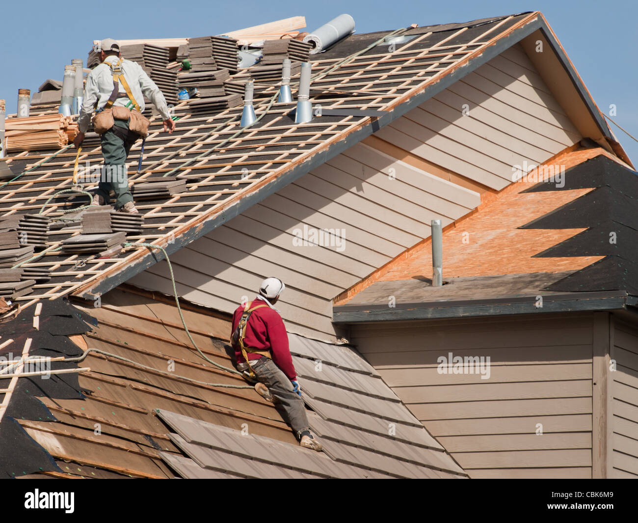 Roof repairs of an apartment building in Colorado Stock Photo - Alamy