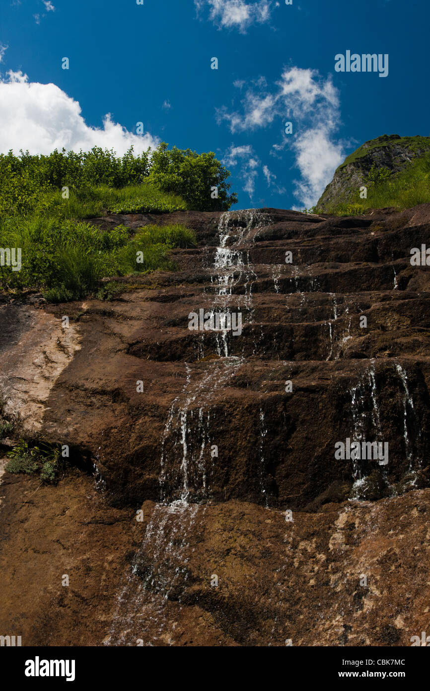 Waterfall falling from slope rocks in Austria Stock Photo - Alamy