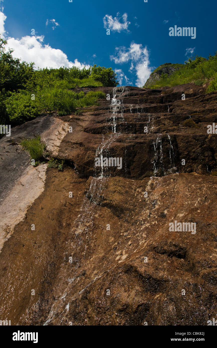 Waterfall falling from slope rocks in Austria Stock Photo - Alamy
