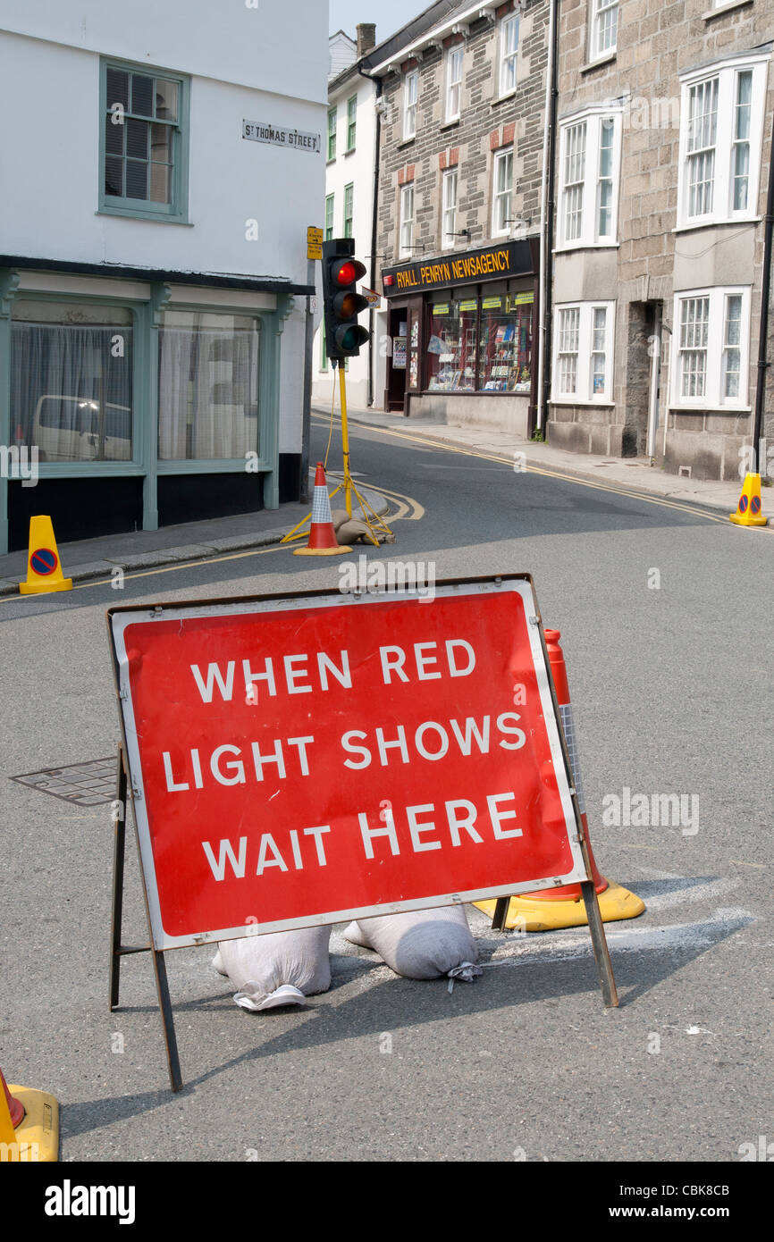 When red light shows wait here traffic lights sign Stock Photo - Alamy