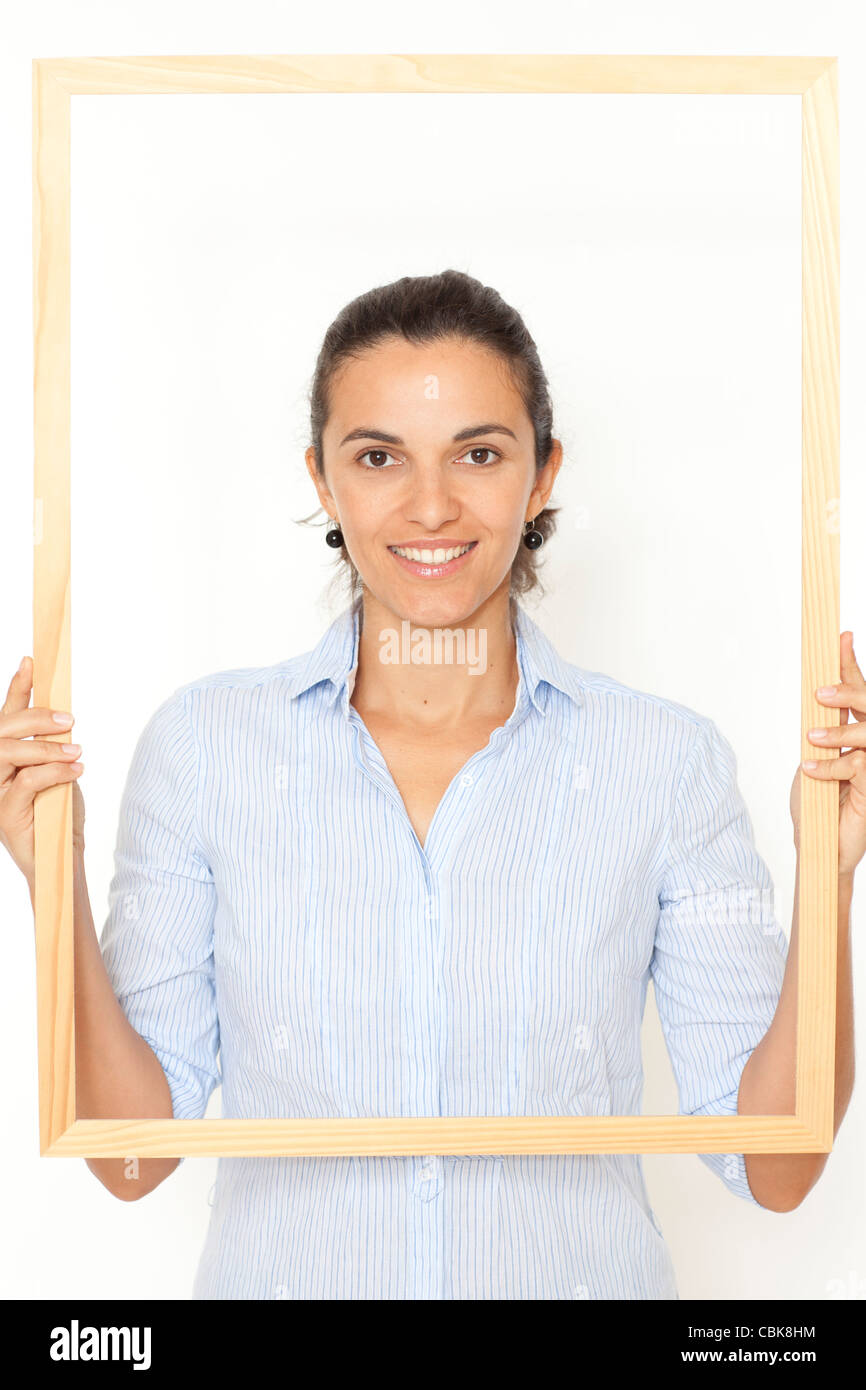 Pretty woman with a frame smiling Stock Photo - Alamy