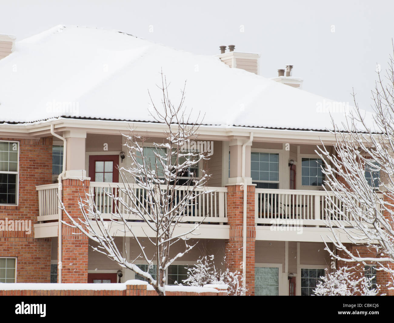Apartment building after snow storm Stock Photo - Alamy