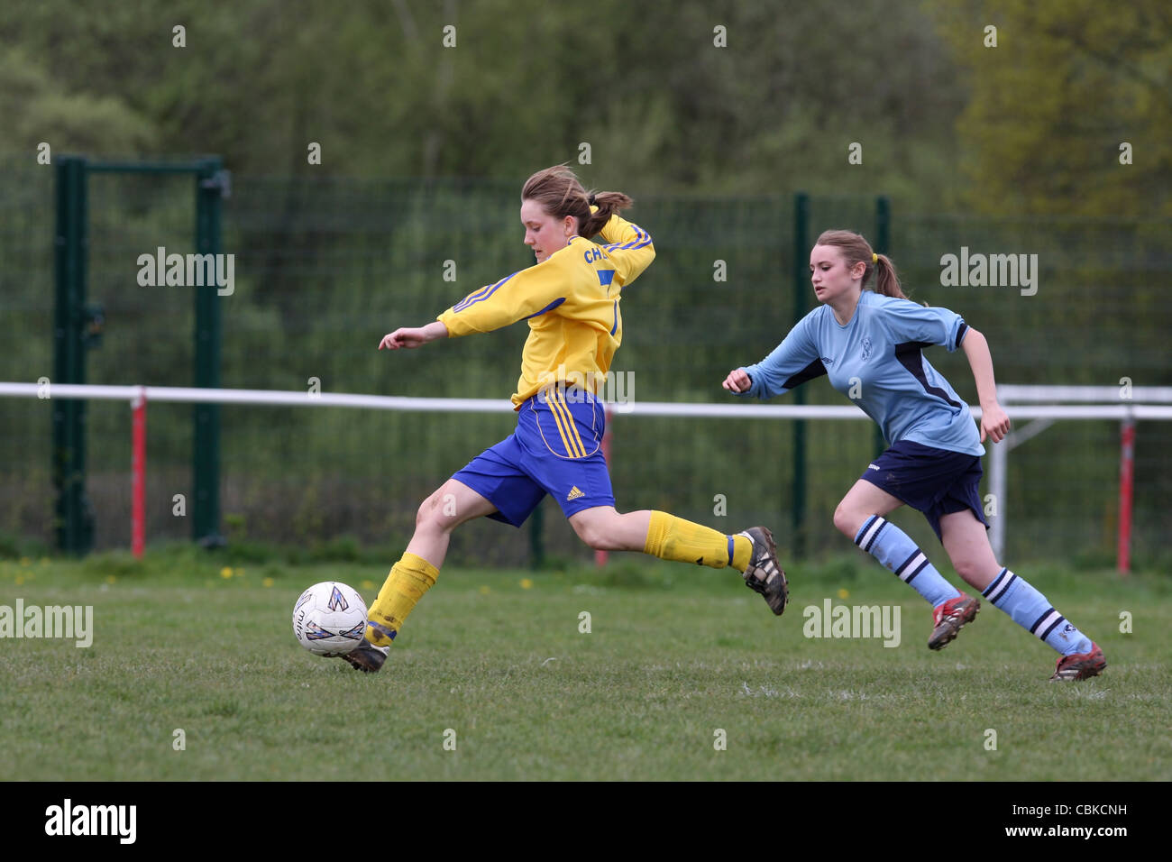 Girls playing football Stock Photo - Alamy