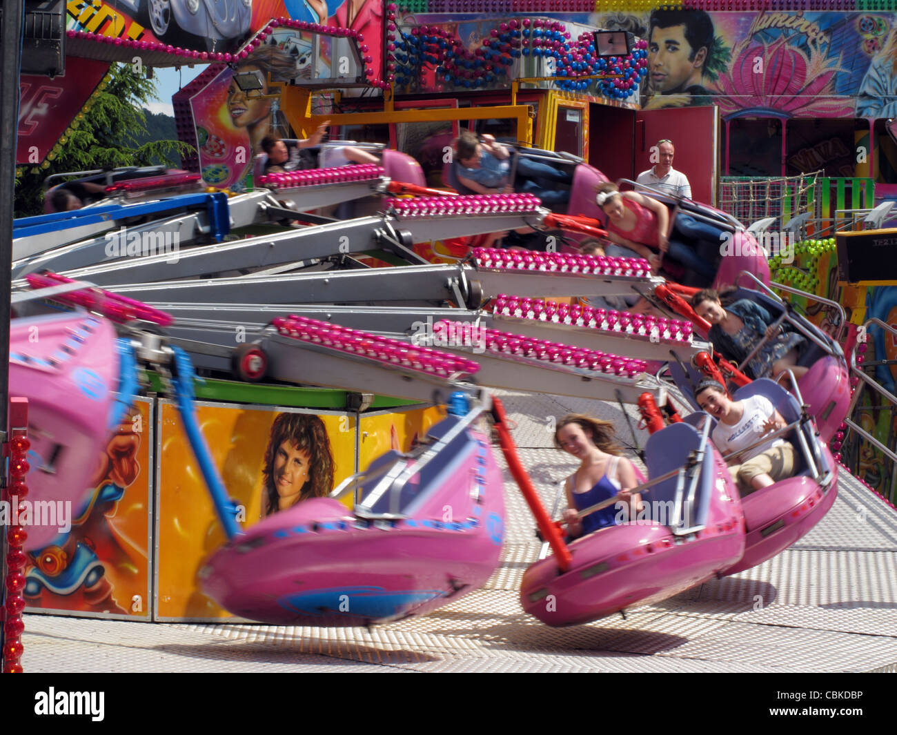 people having fun on a fairground ride Bakewell Derbyshire England ...