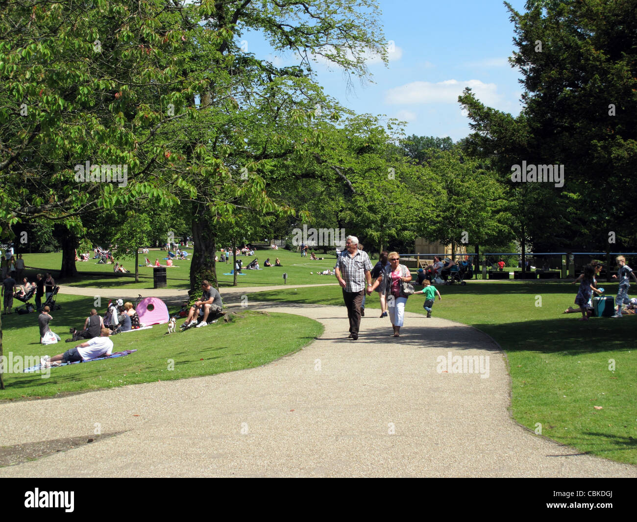 crowds of people relaxing and enjoying the summer weather in Buxton ...
