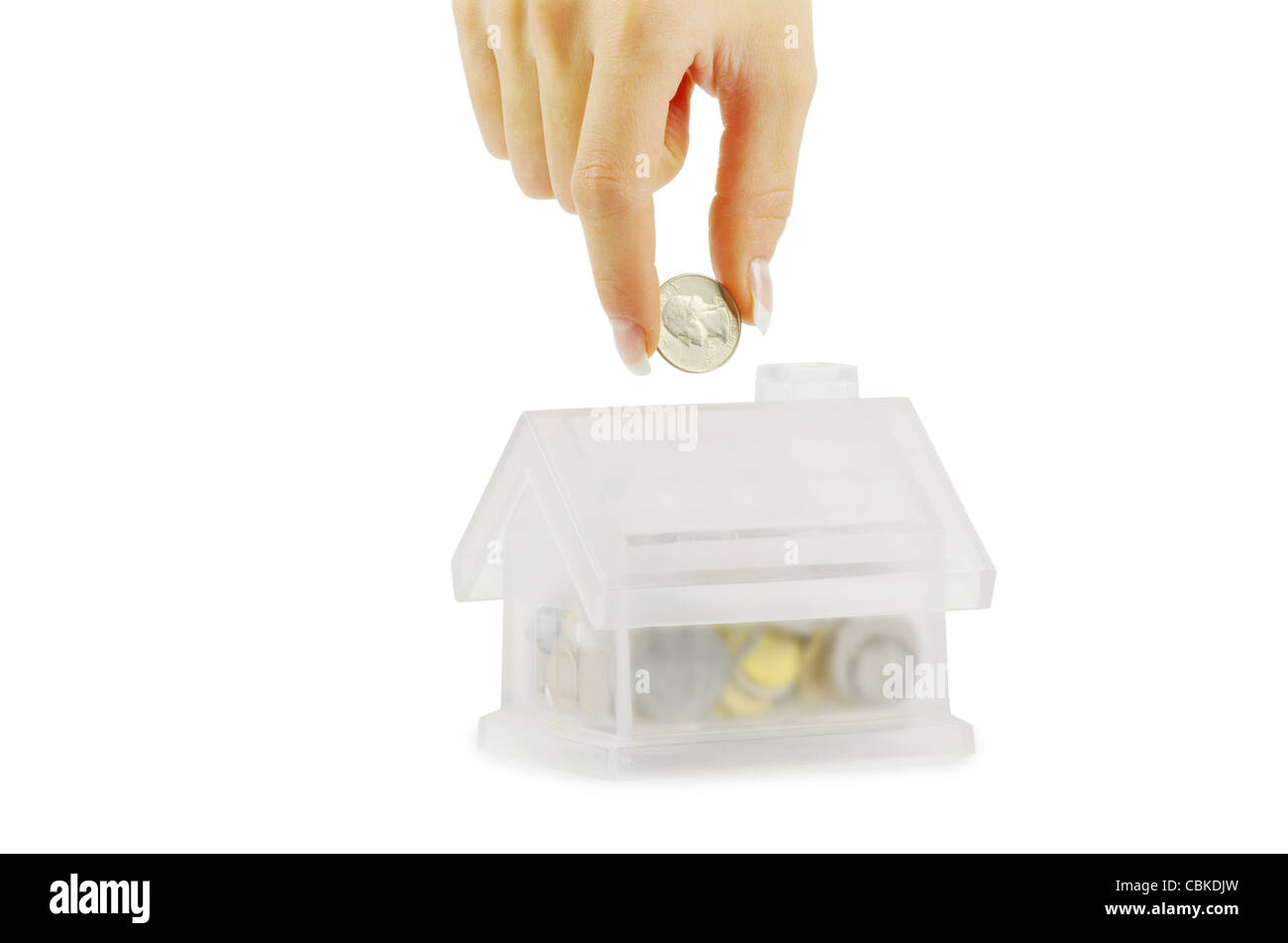 Hand with coin and house bank isolated on white background Stock Photo ...