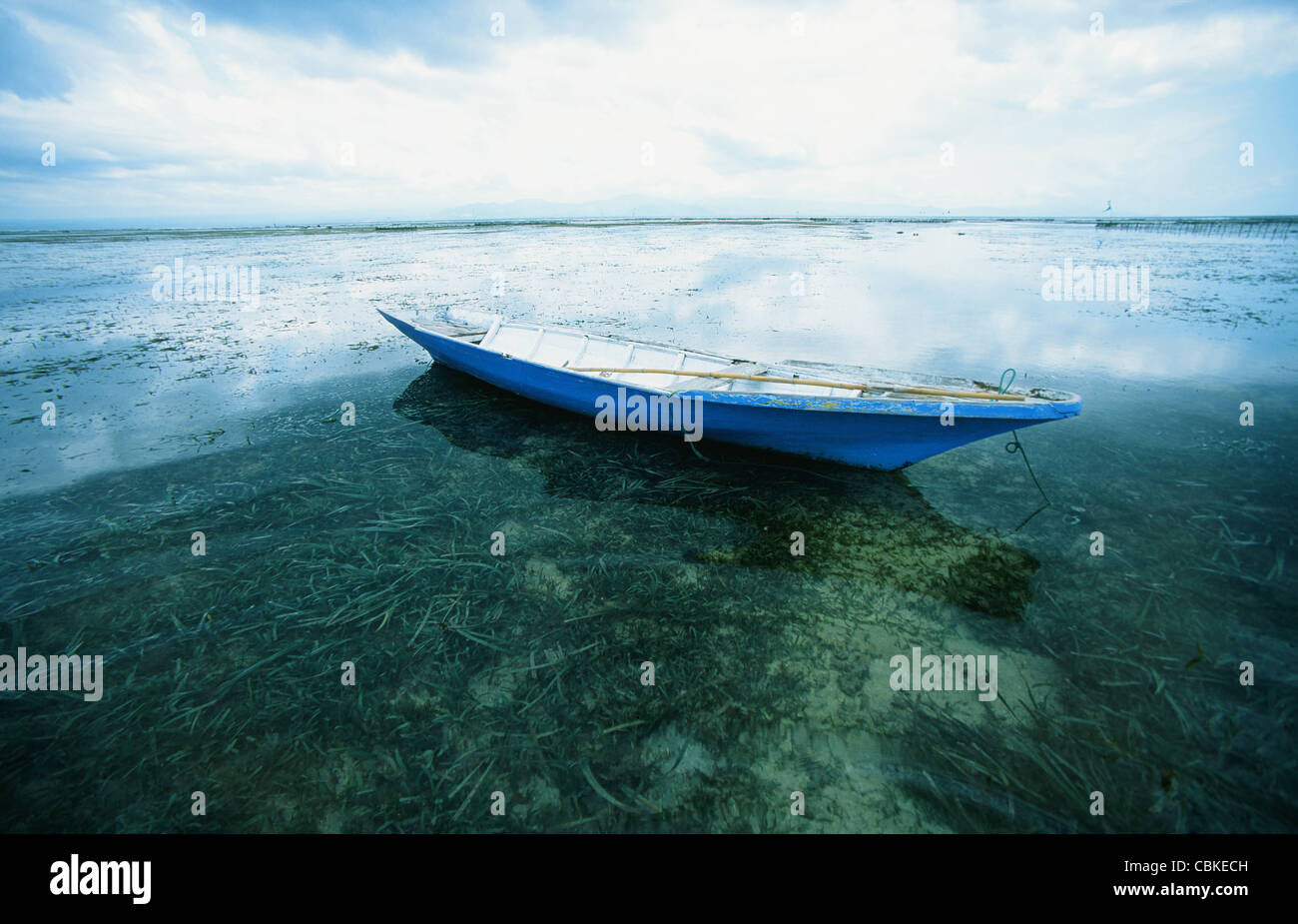 wood boat of seaweed farmer at the Indonesian island of Nusa Lembongan ...