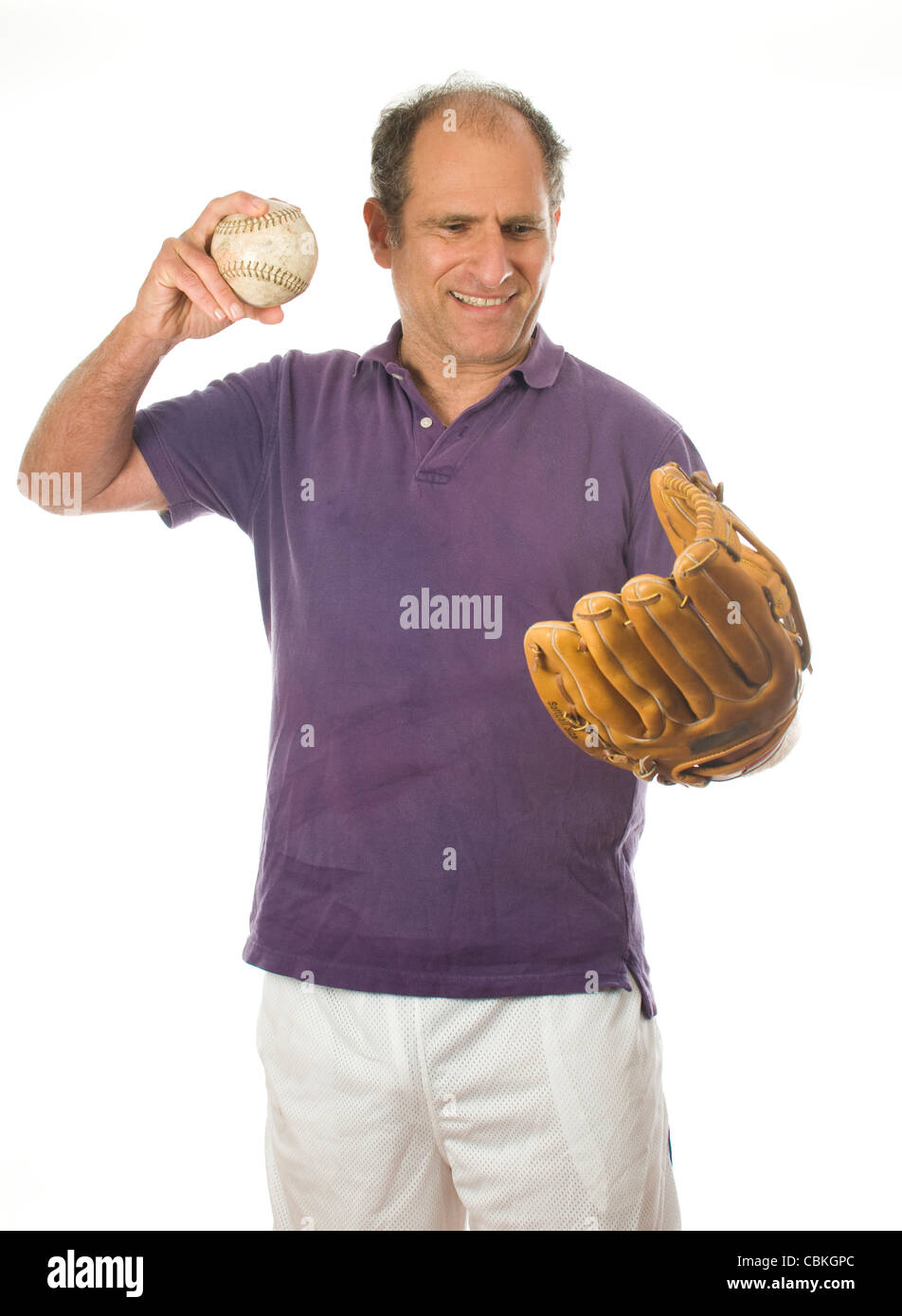 handsome middle age senior man softball throwing into baseball glove on ...