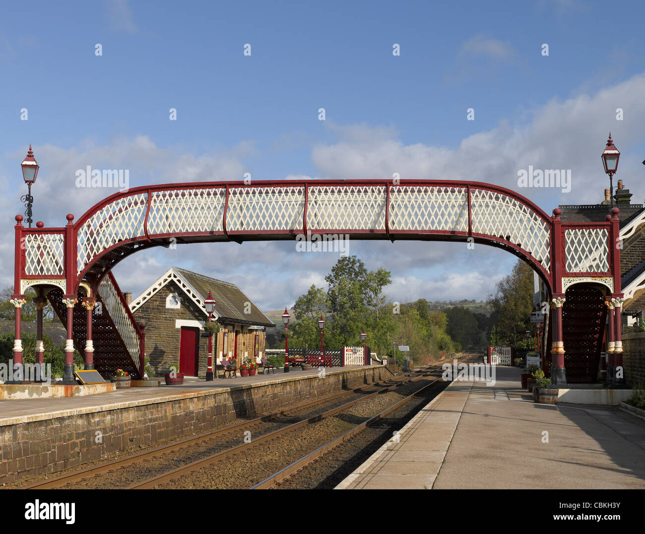 Footbridge bridge across the railway track at Settle train station ...