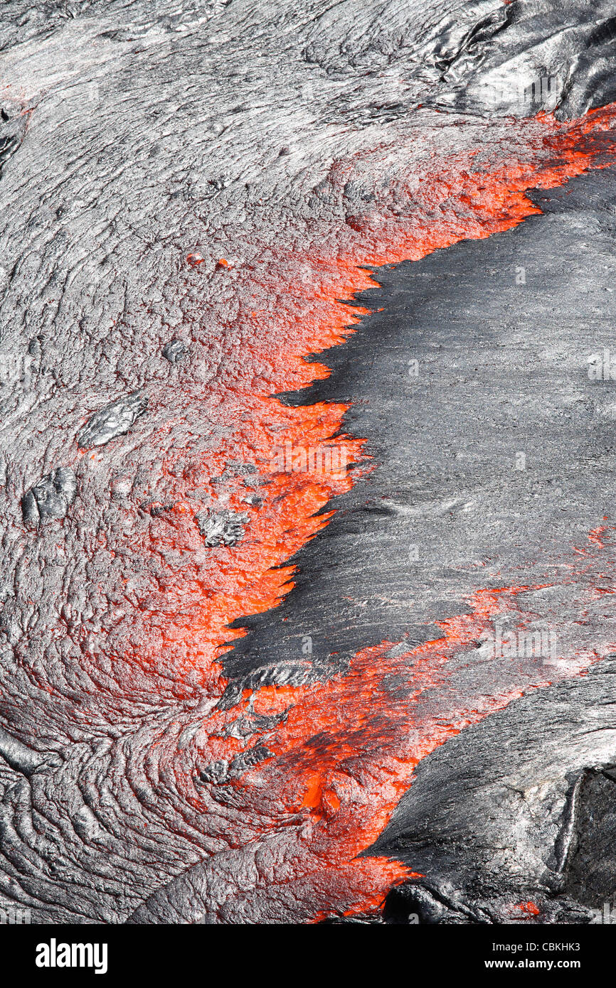 Lava flowing from under crust of active lava lake, Erta Ale volcano ...