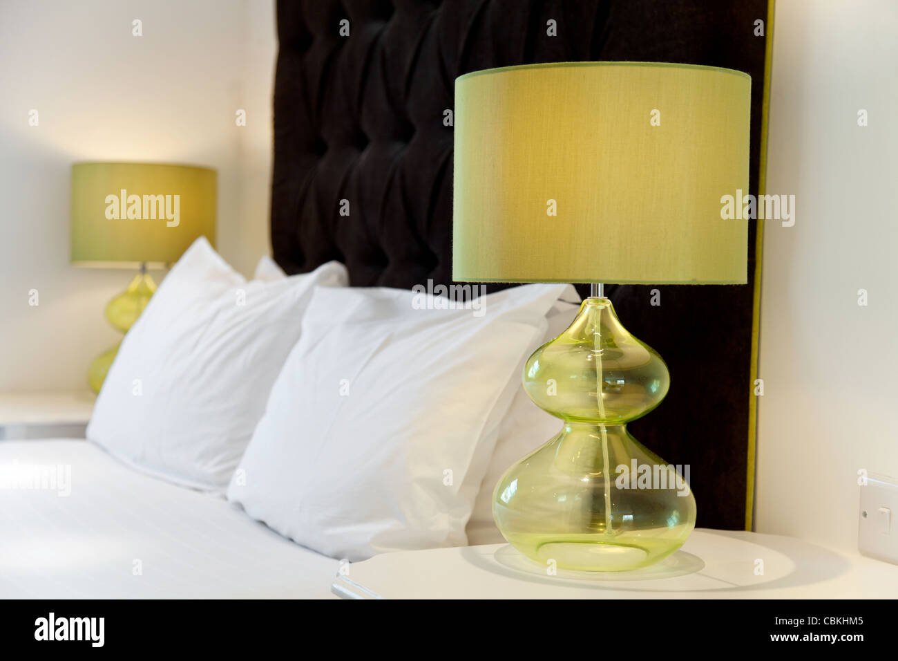 Luxurious modern bed design and bedside lamps Stock Photo - Alamy
