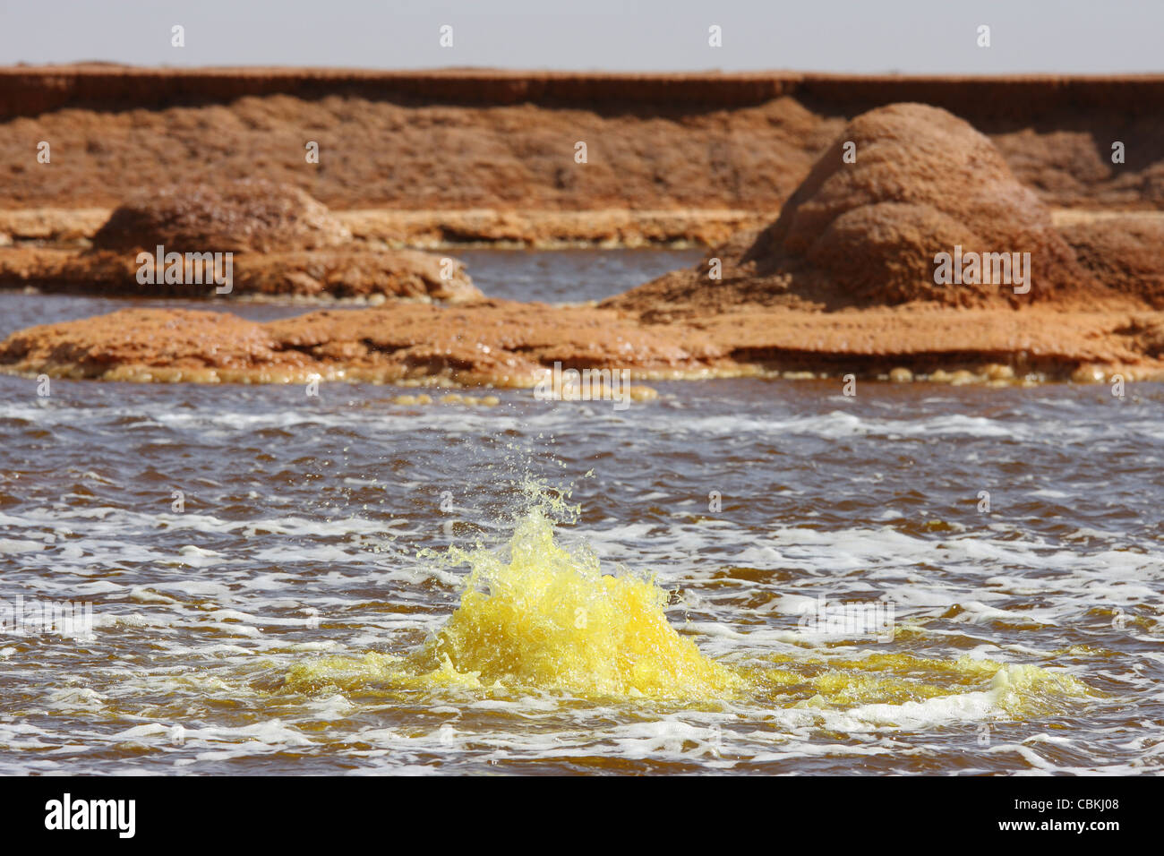 Dallol geothermal area, hot spring in yellow brine lake containing ...