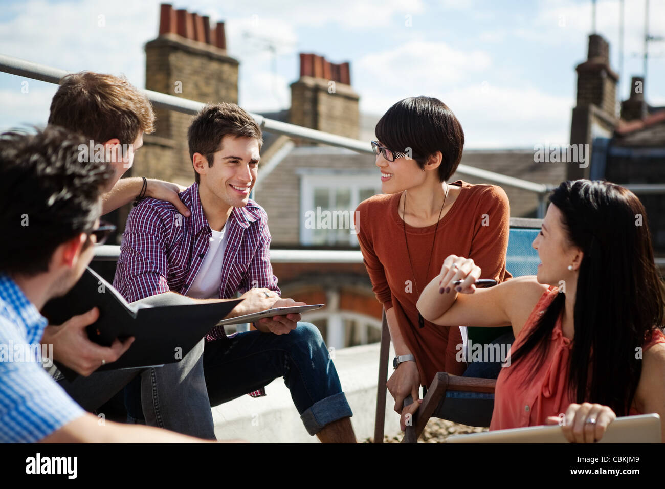 Group of people congratulating their friend Stock Photo - Alamy