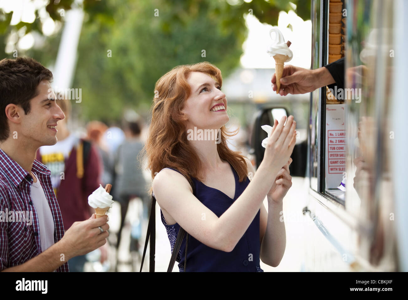 Handing ice cream hi-res stock photography and images - Alamy