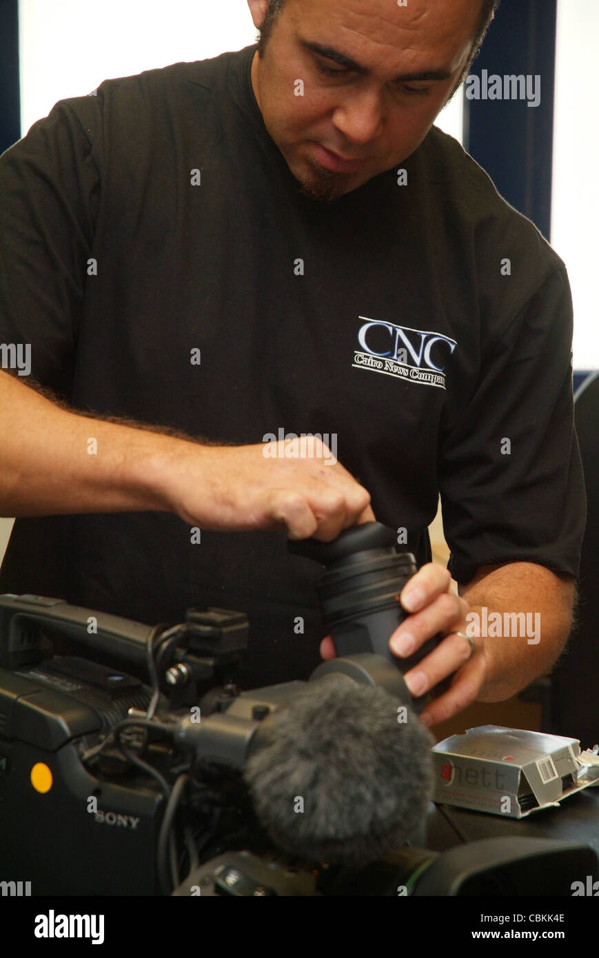 Nick Porter, cameraman for Al Jazeera English doing maintenance on ...