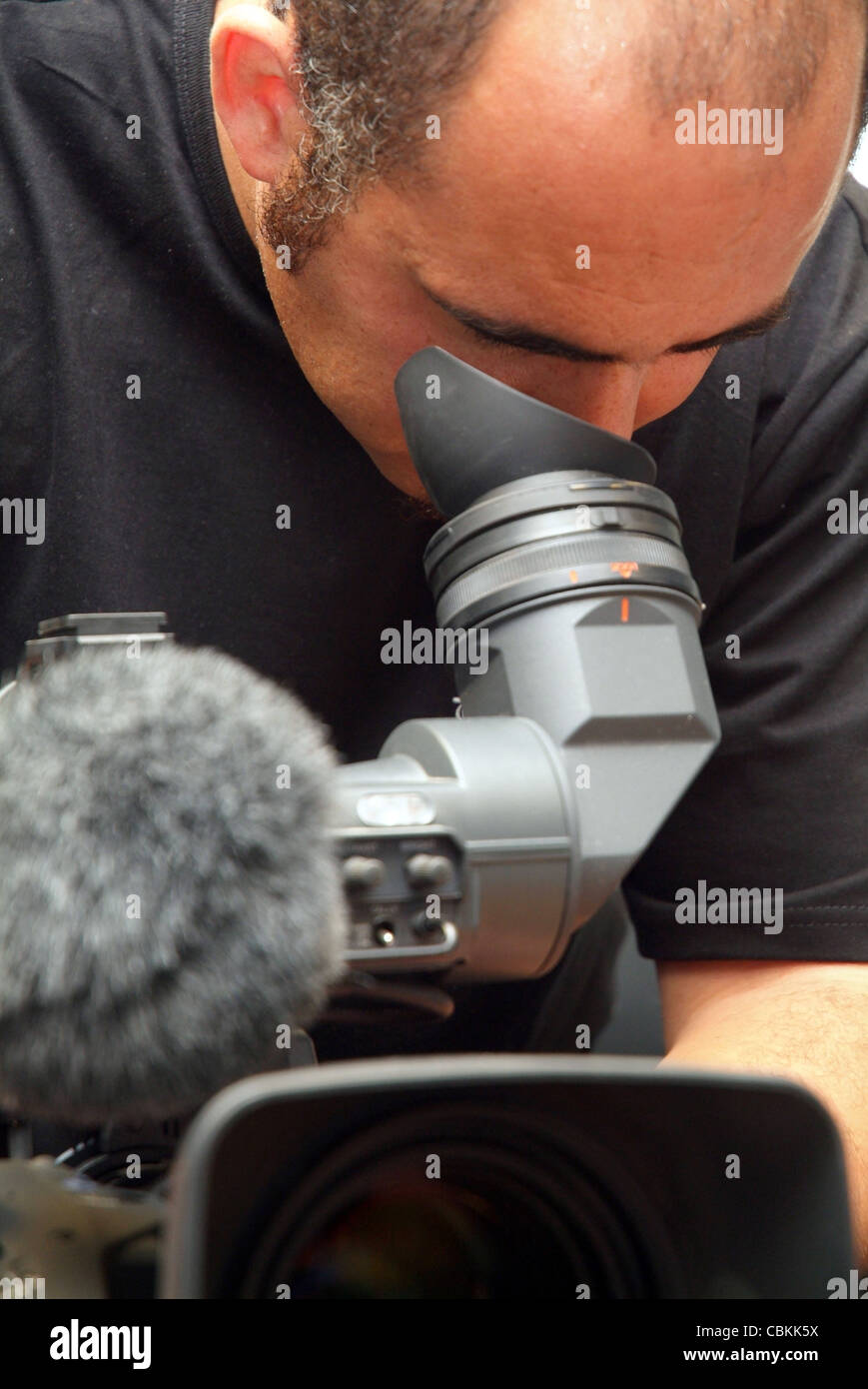 Nick Porter, cameraman for Al Jazeera English doing maintenance on ...