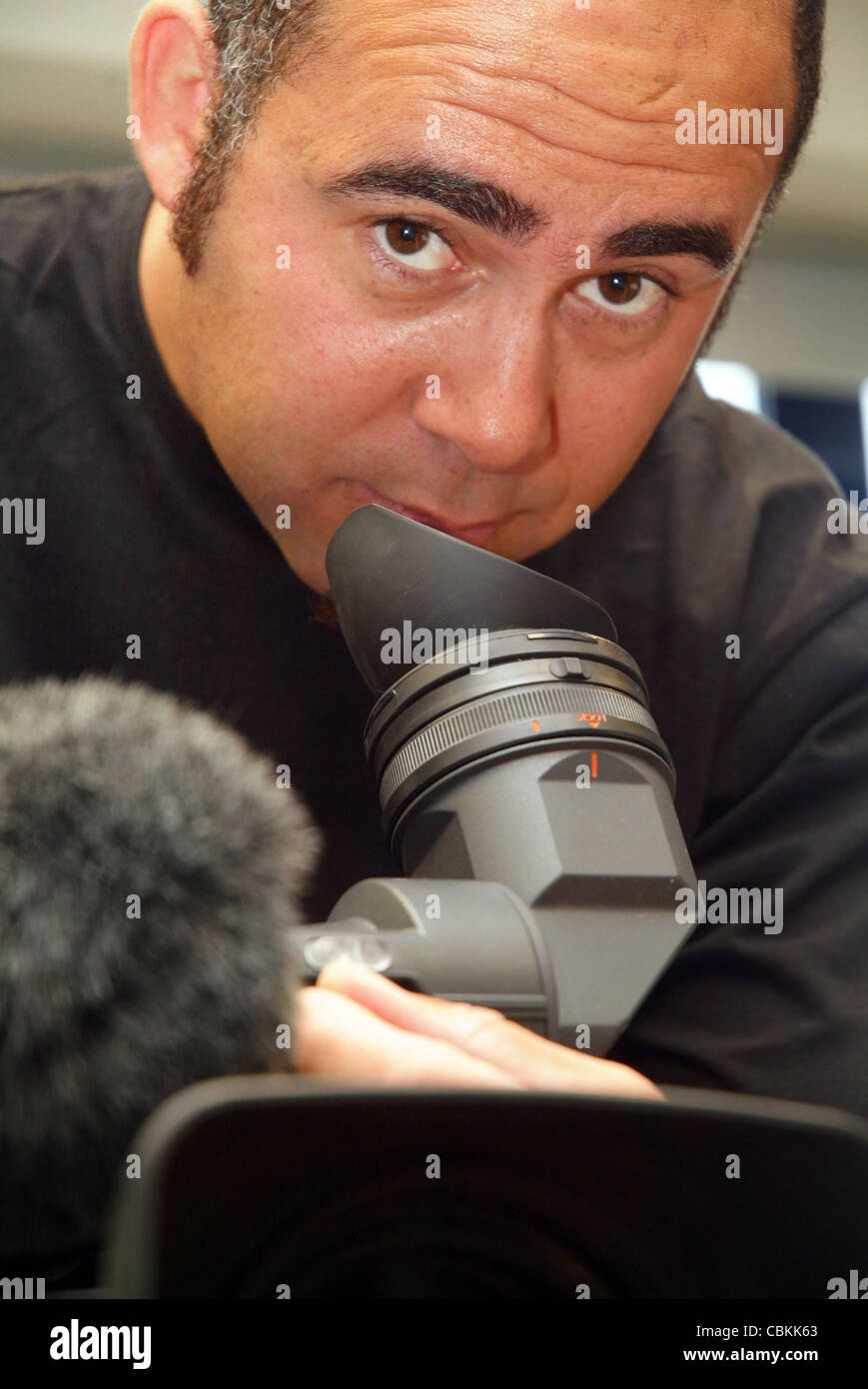 Nick Porter, cameraman for Al Jazeera English doing maintenance on ...