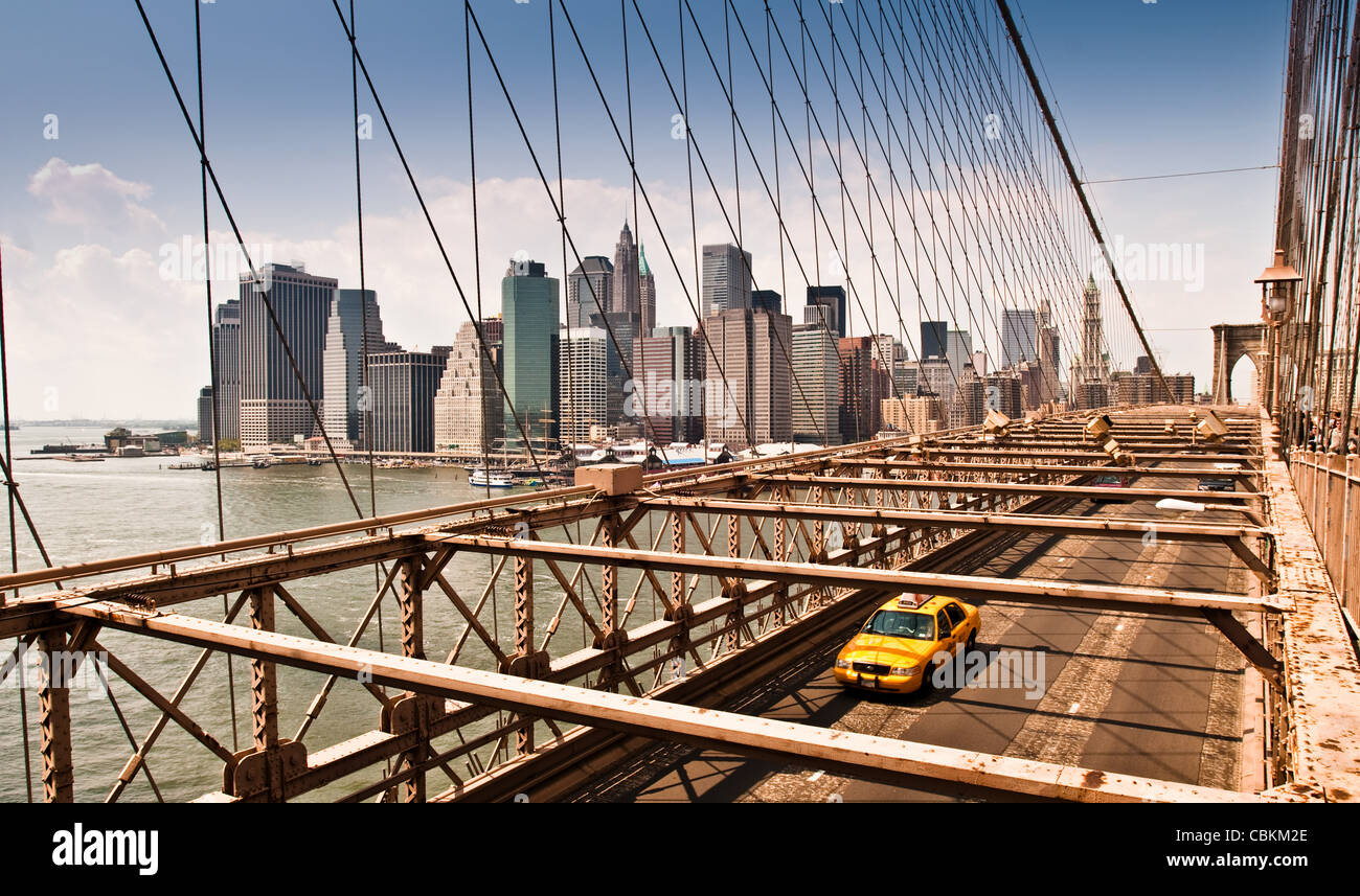 Yellow taxi cab crossing Manhattan Bridge, Manhattan, New York, USA ...