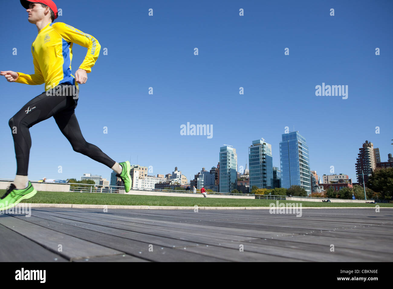 Man running on timber walkway Stock Photo - Alamy