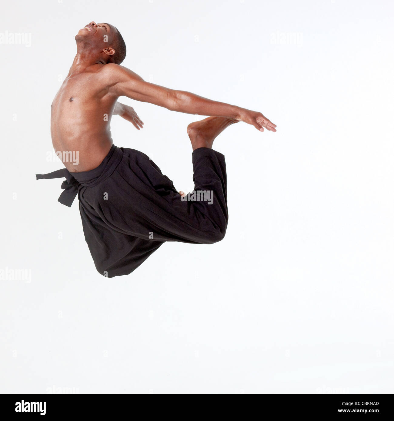 Young man in mid air Stock Photo - Alamy