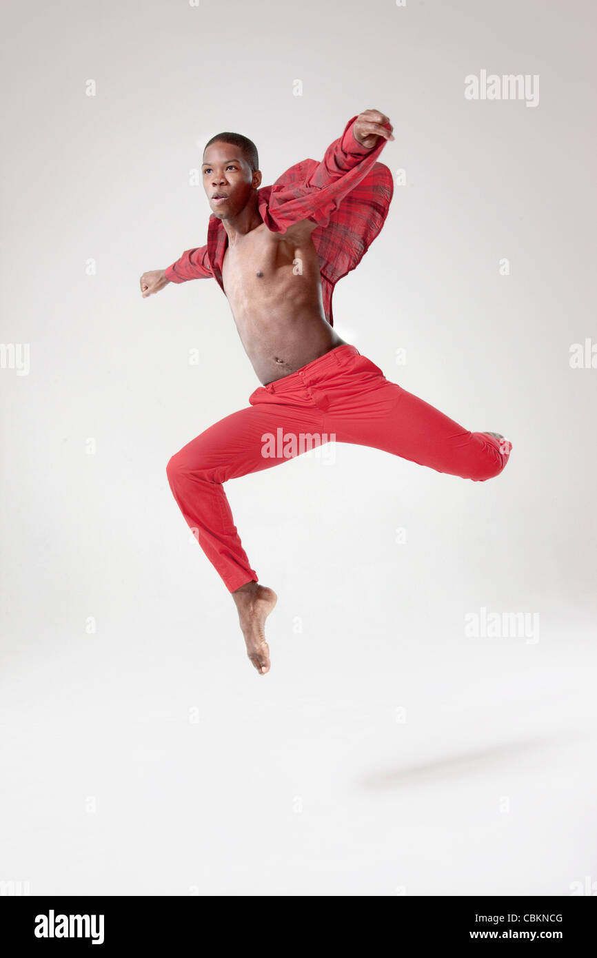 Young dancer in mid air Stock Photo - Alamy