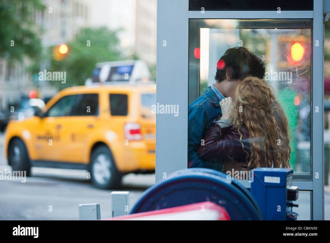 Young couple kissing in telephone booth Stock Photo - Alamy