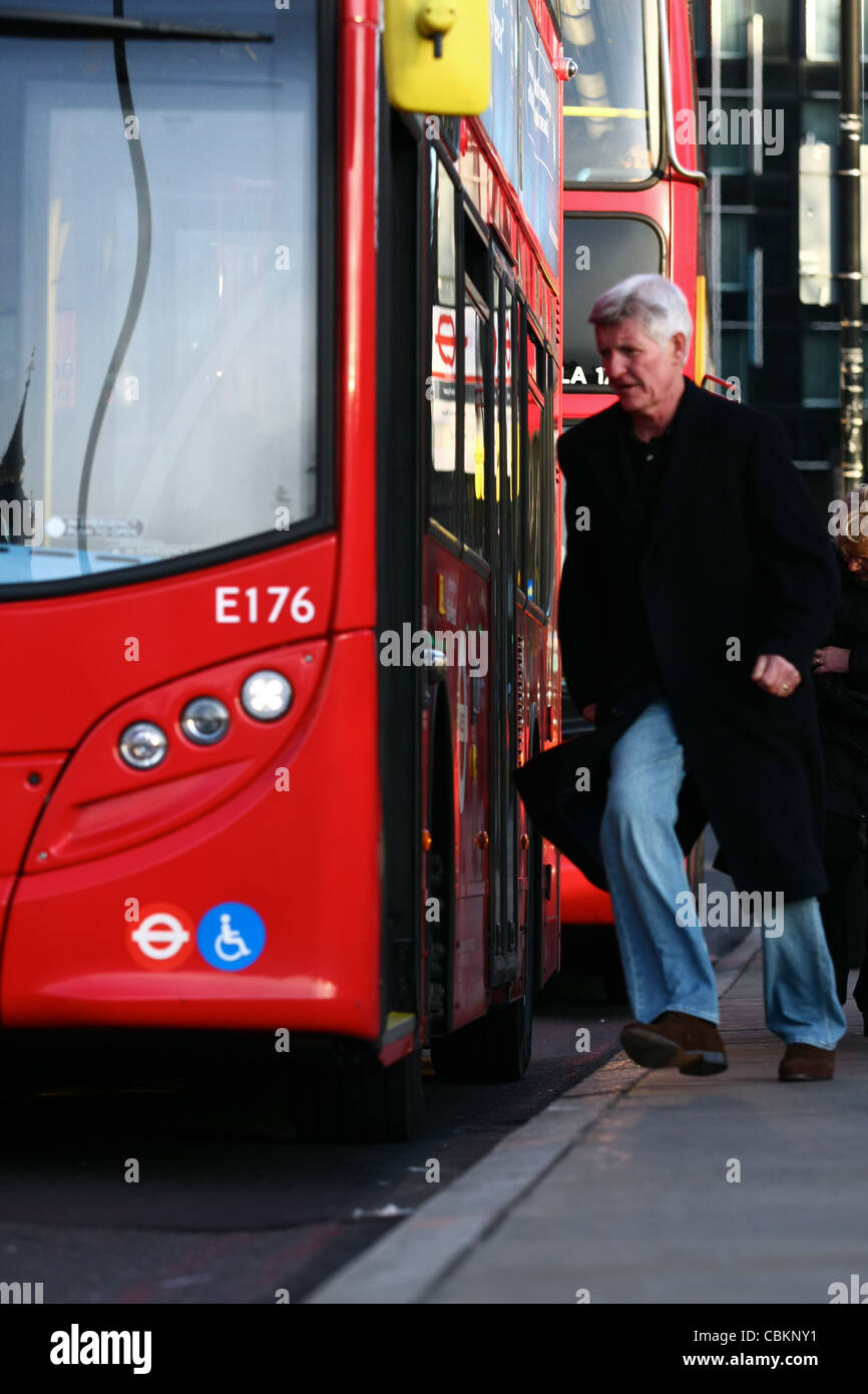 Running to catch bus hi-res stock photography and images - Alamy