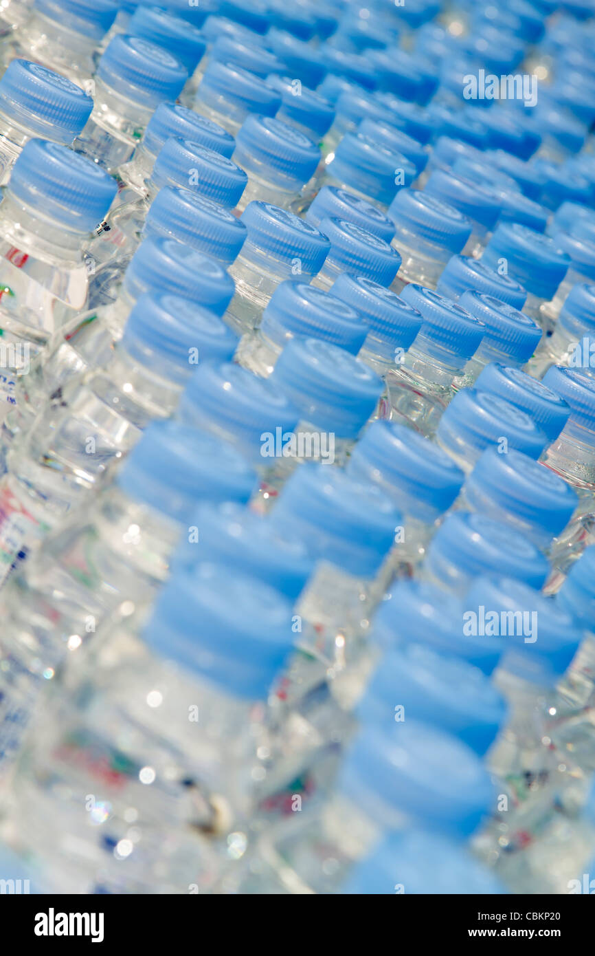 Bottled spring water in the row Stock Photo - Alamy