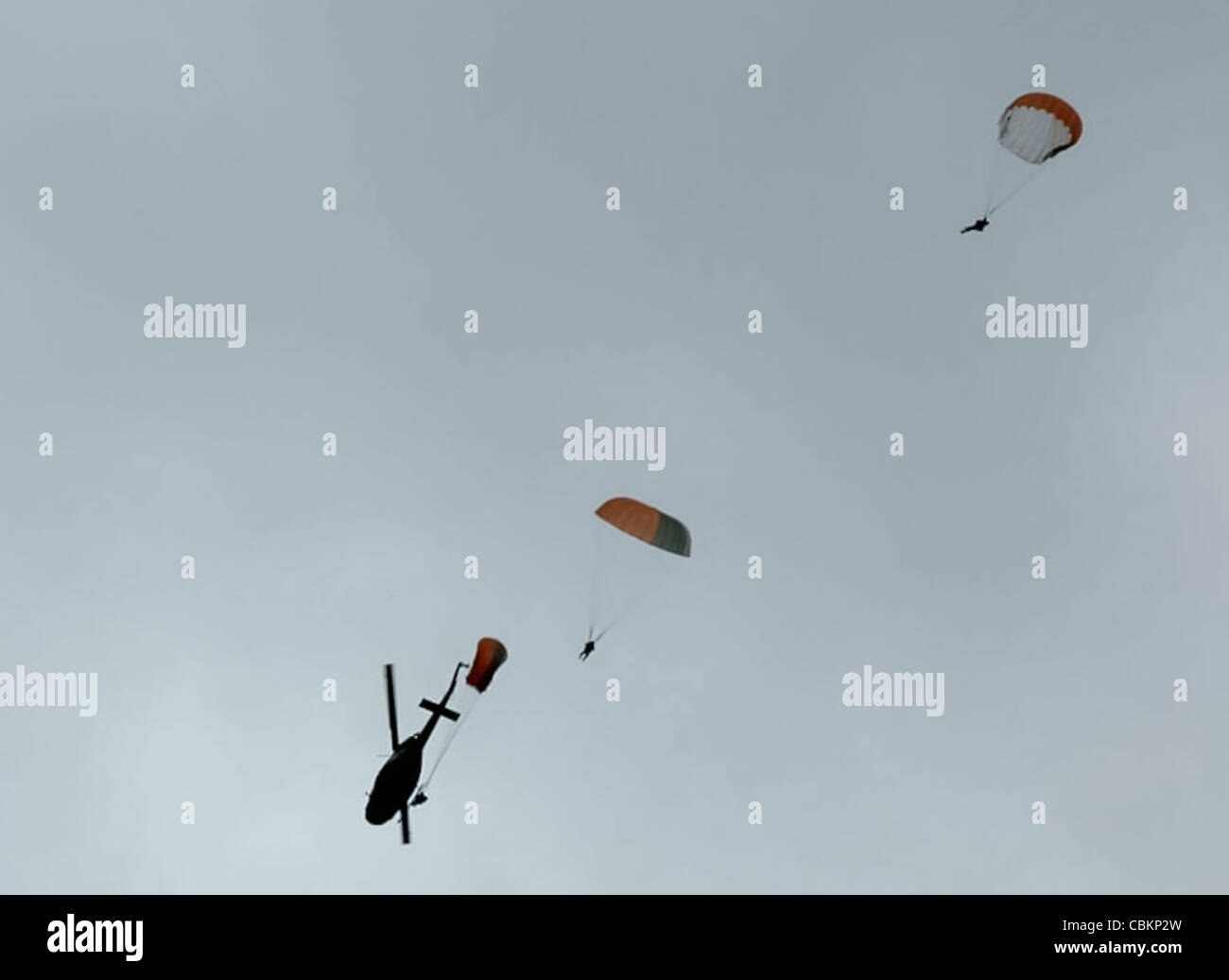 Students practice static line parachuting techniques from a UH-1N Huey ...