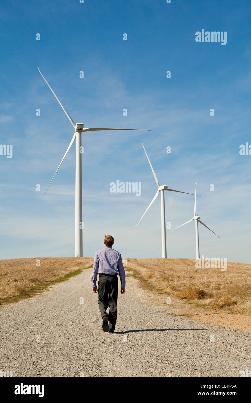 Man walking towards wind turbine hi-res stock photography and images ...
