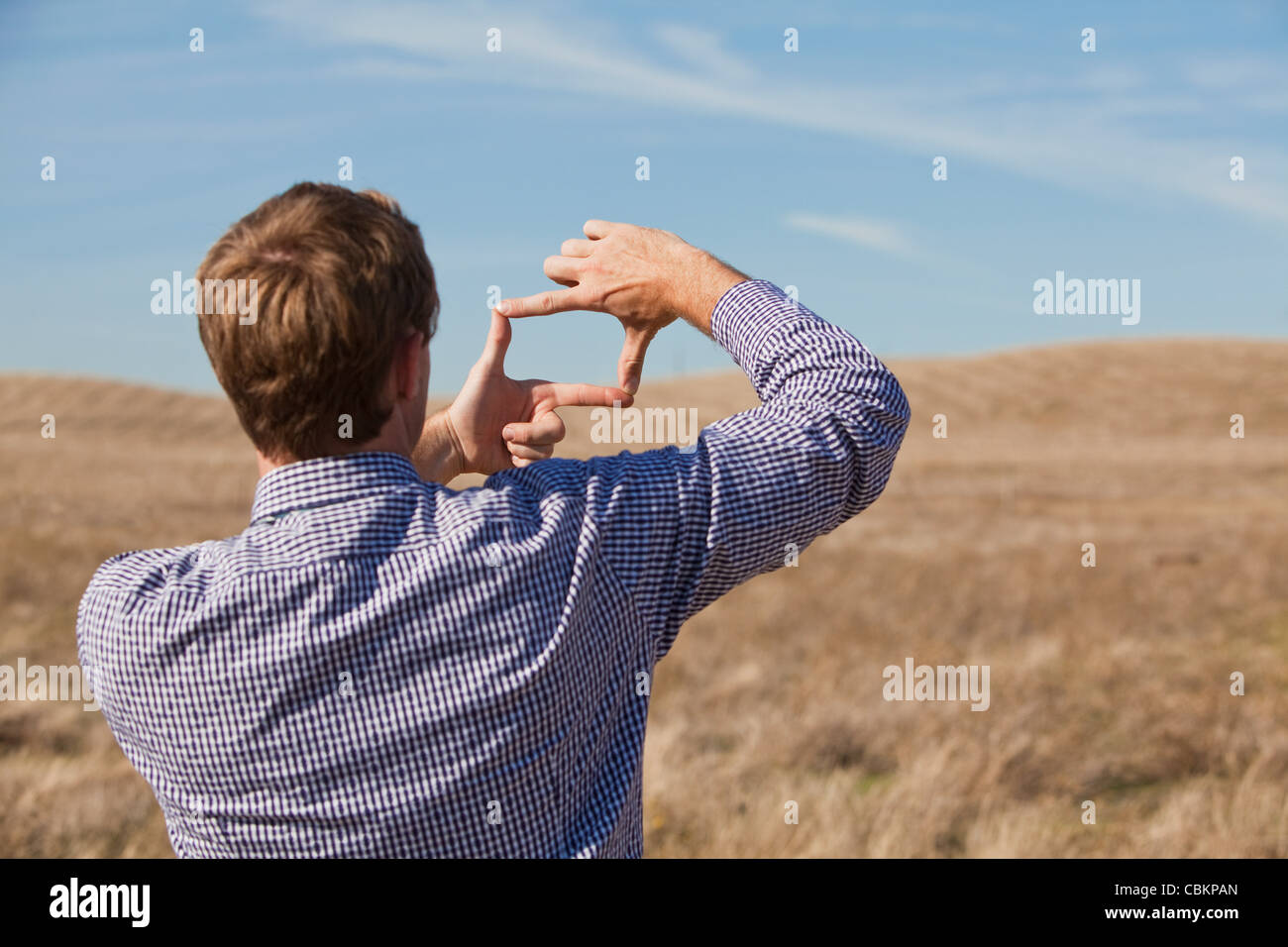 Man using hands to frame landscape Stock Photo - Alamy