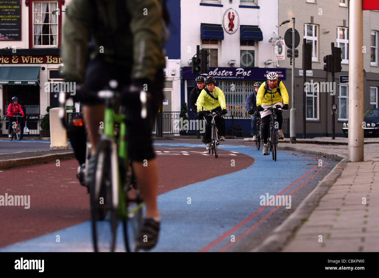 cyclists traveling along a cycle superhighway in London during the ...