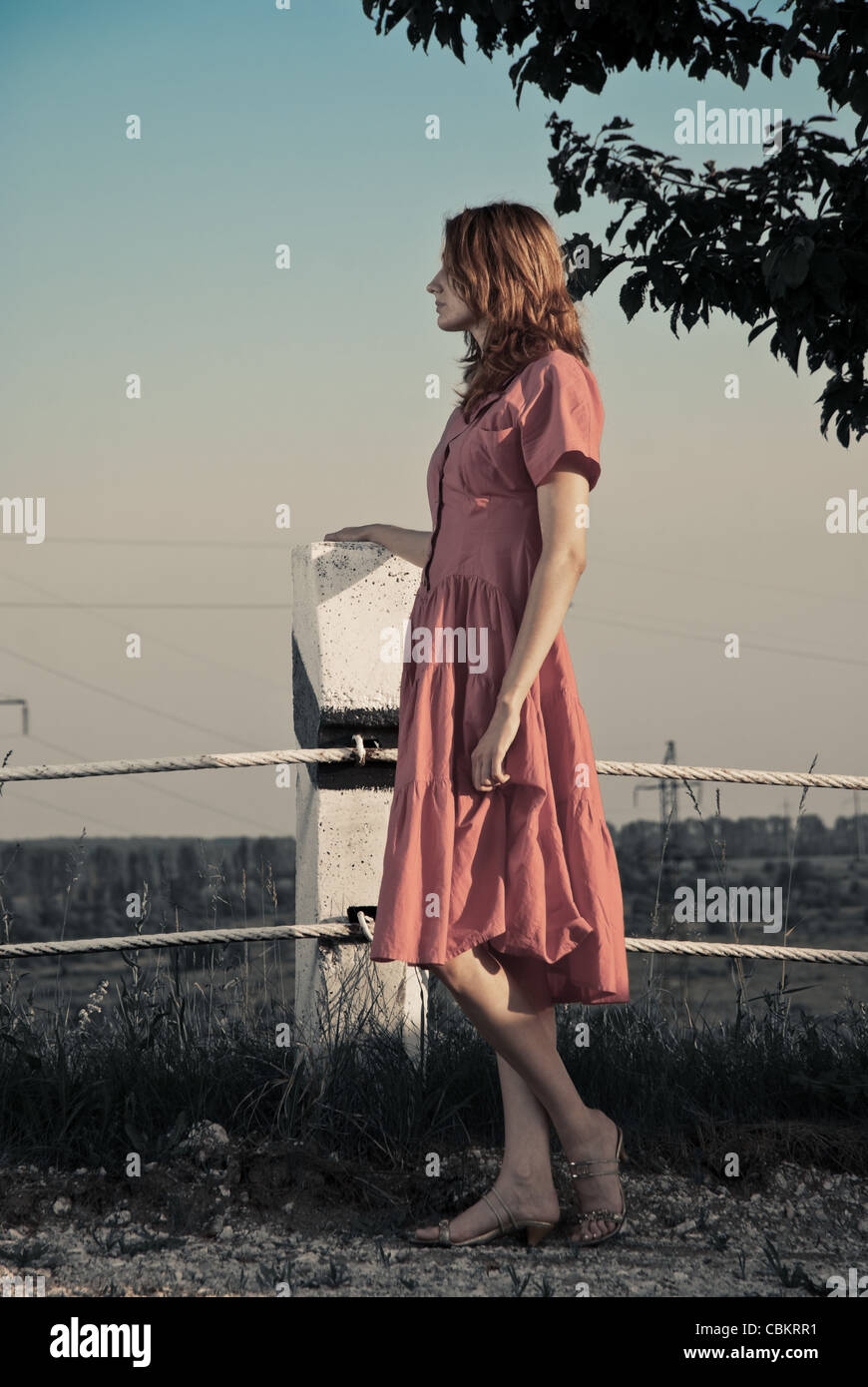 Woman at roadside Stock Photo - Alamy