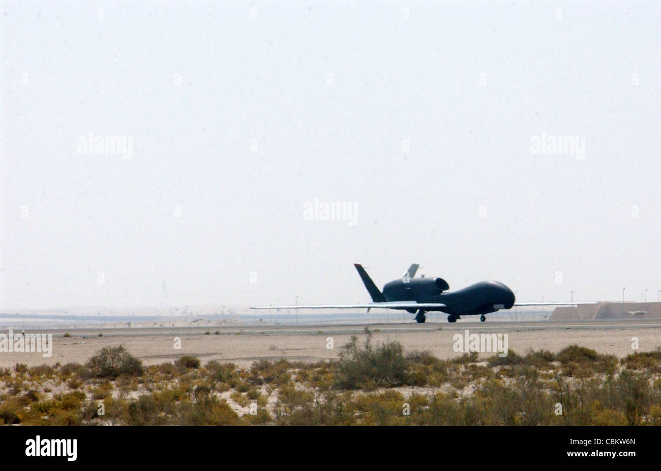 A Global Hawk unmanned aerial vehicle lands at a deployed location in ...