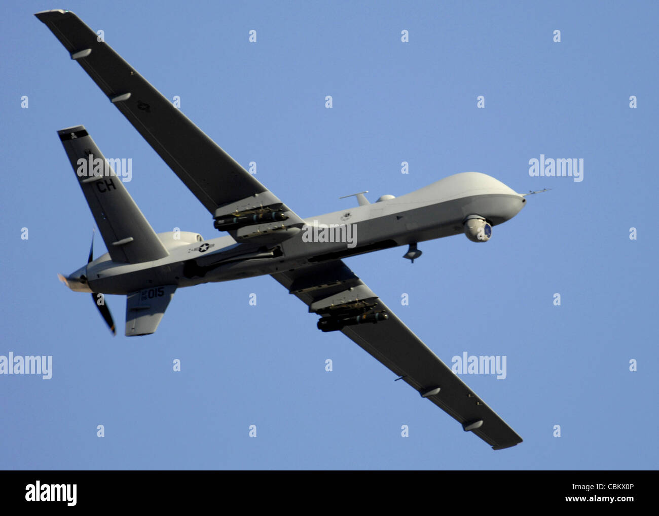 An MQ-9 Reaper unmanned aerial vehicle flies over the crowd during the ...