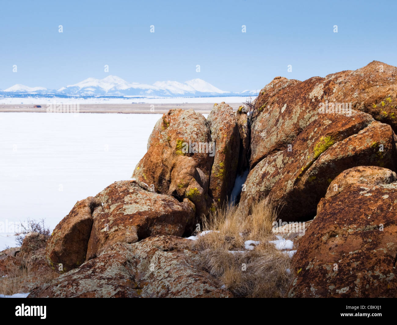 Rocks in winter landscape Stock Photo - Alamy