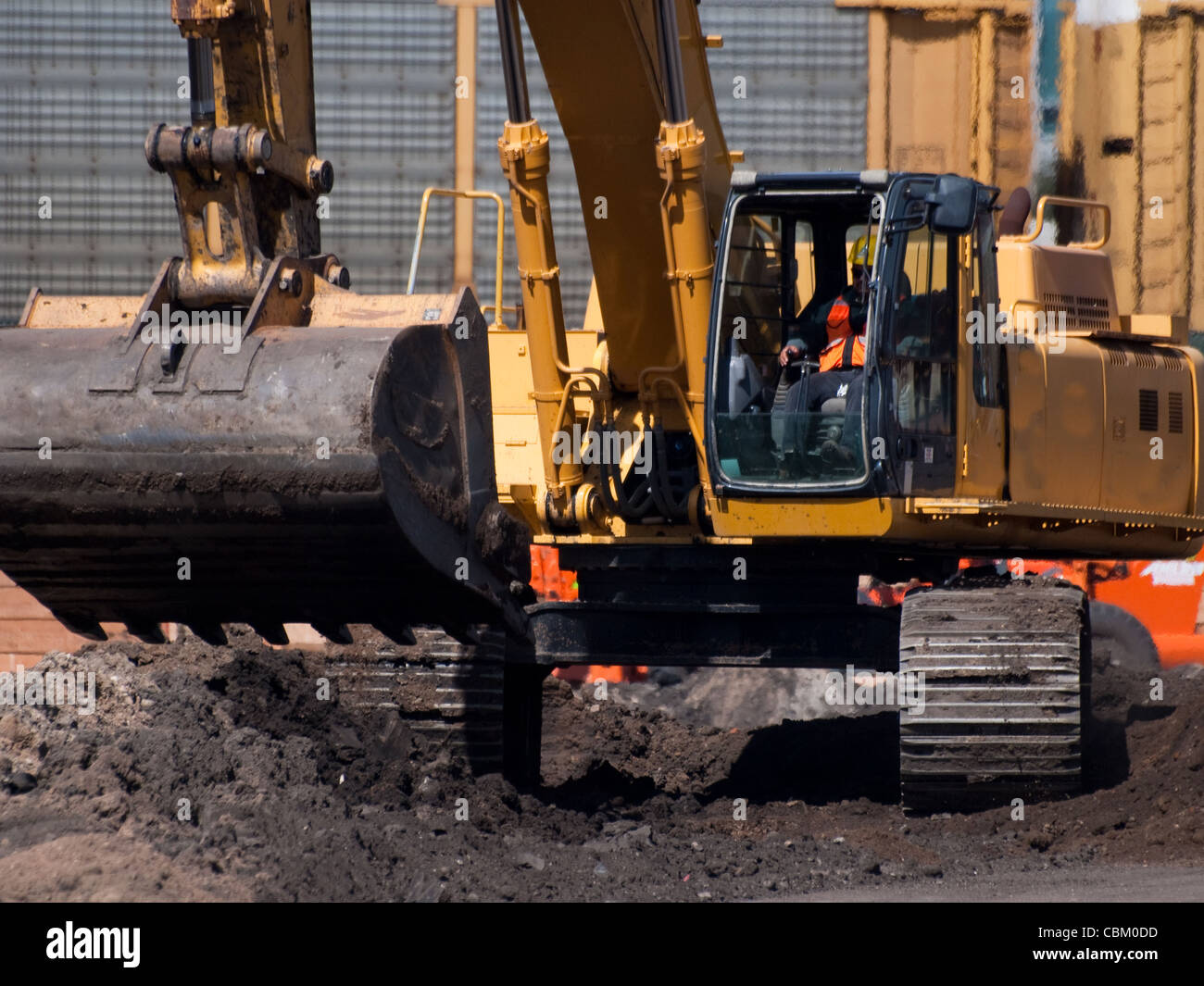 Excavator at work on the construction site Stock Photo - Alamy