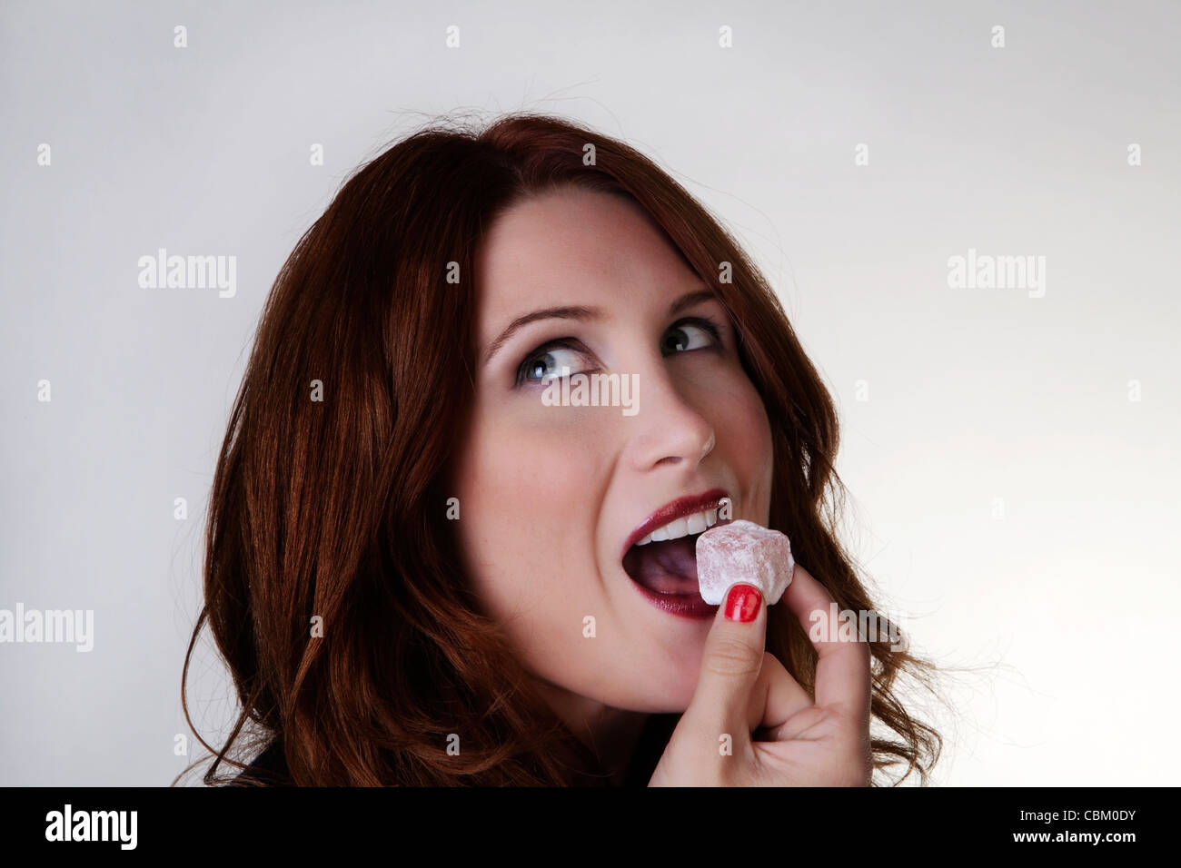 woman eating turkish delight Stock Photo - Alamy