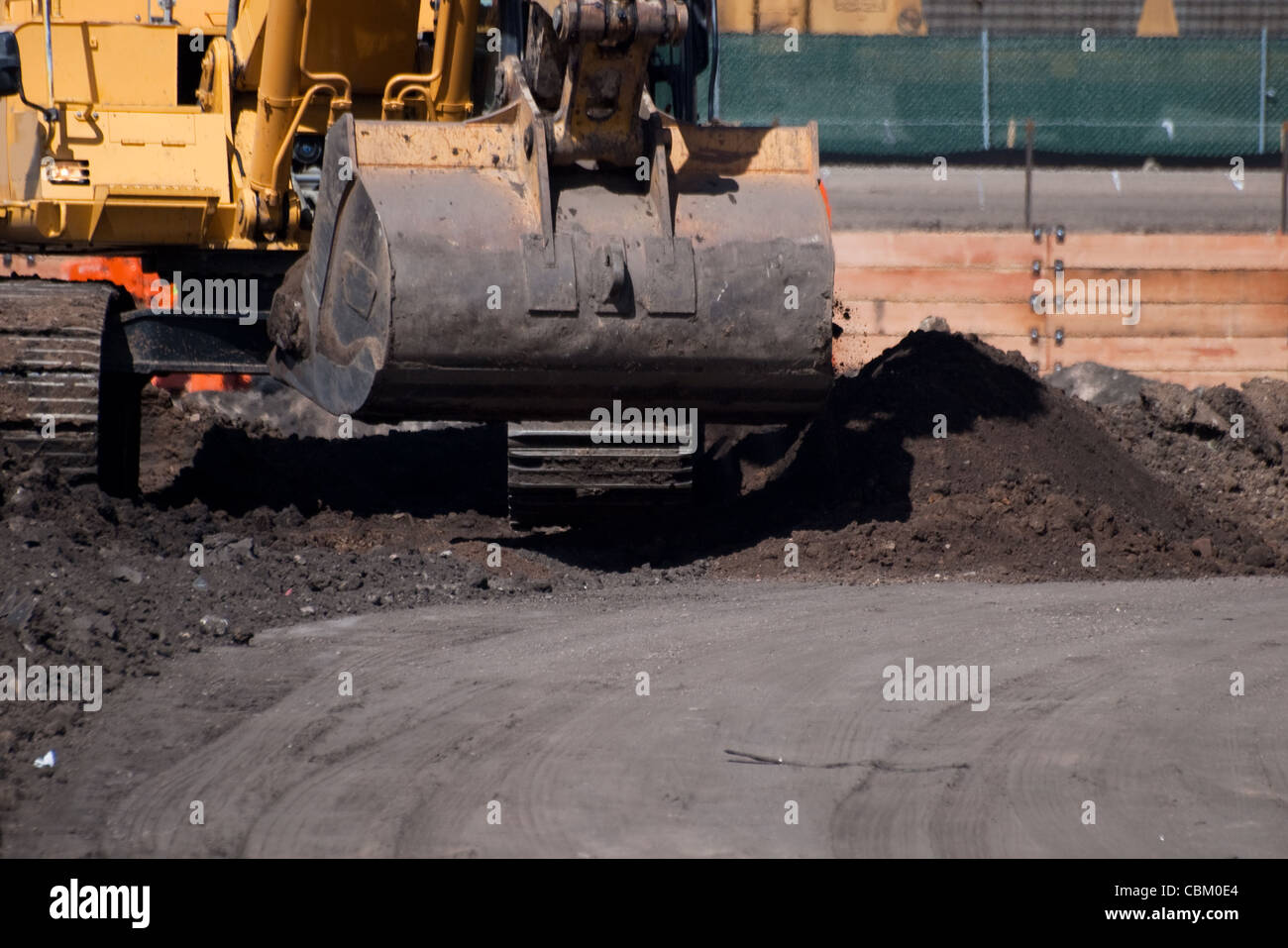 Excavator at work on the construction site Stock Photo - Alamy