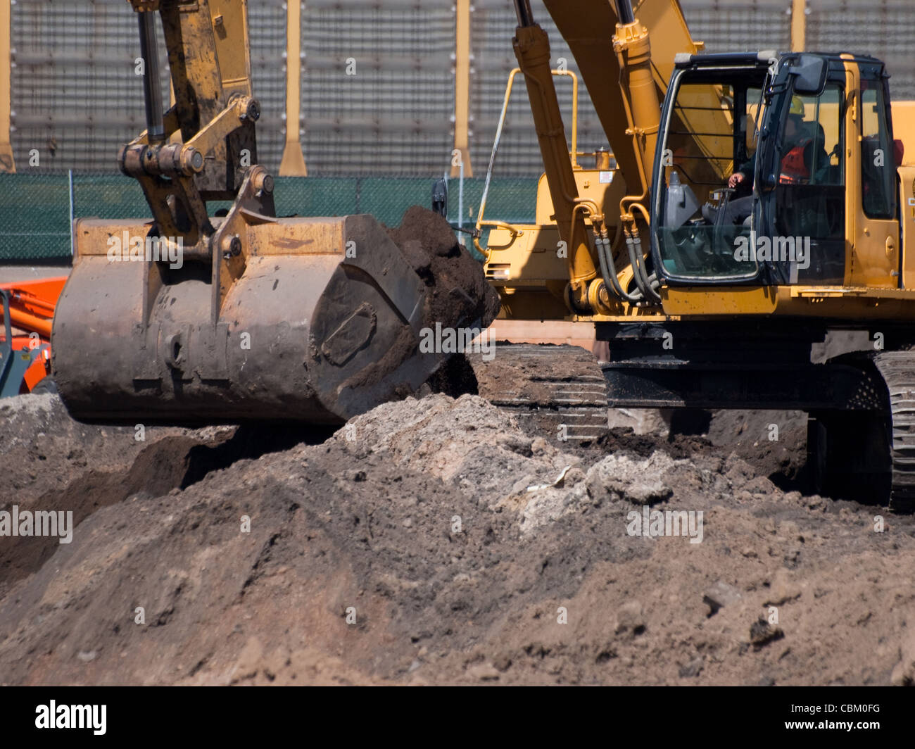 Excavator at work on the construction site Stock Photo - Alamy