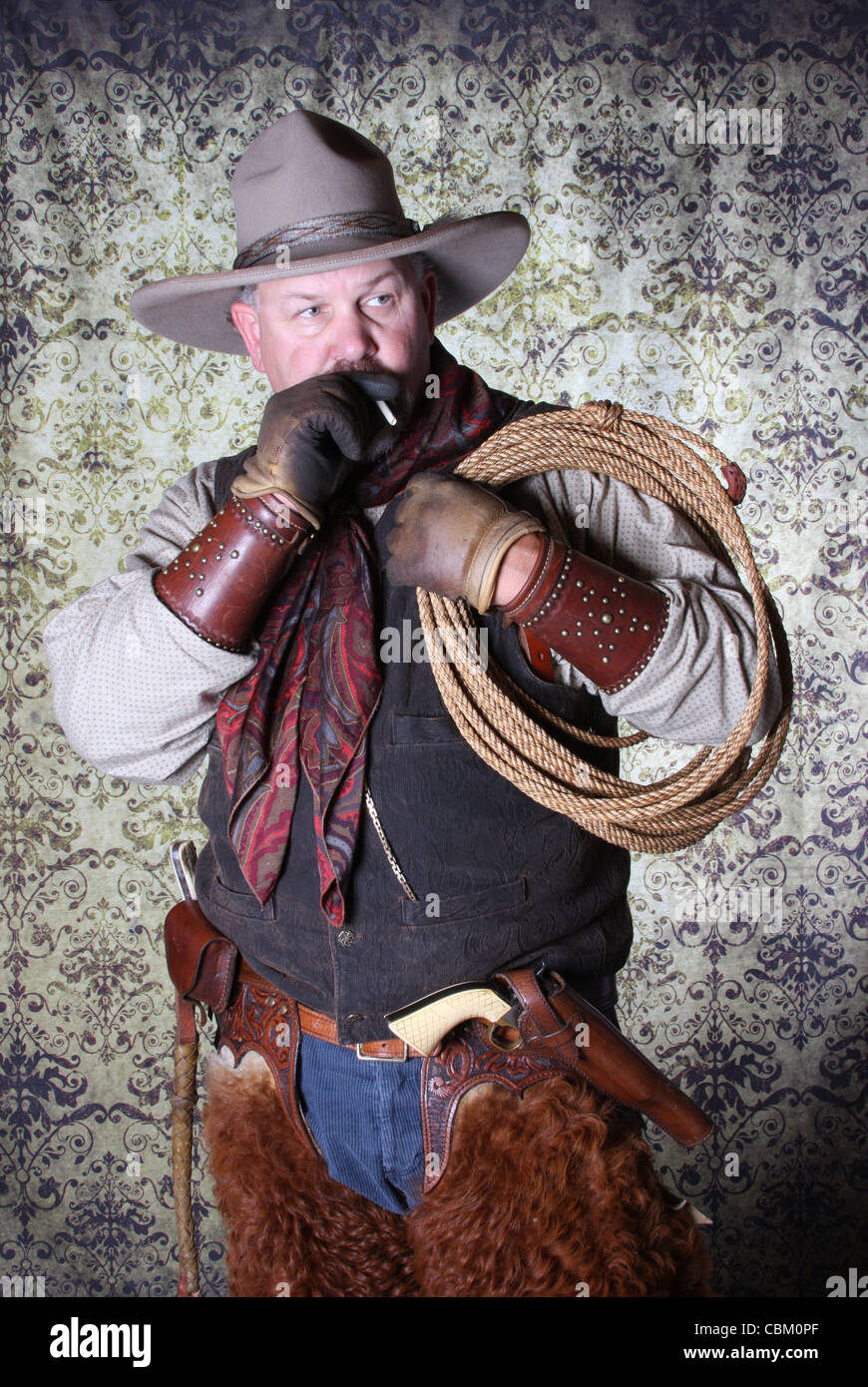 A vintage cowboy smoking Stock Photo - Alamy