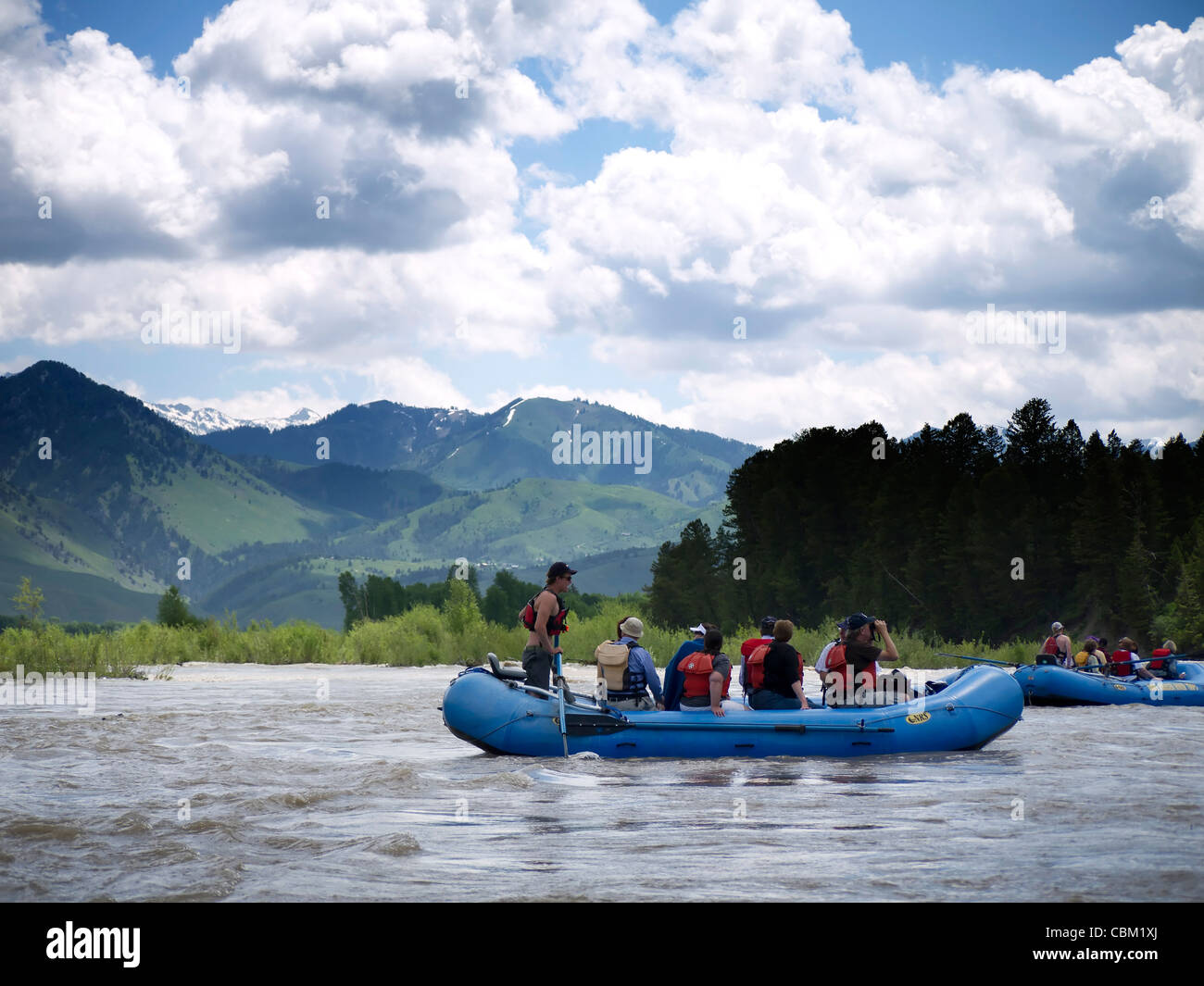 Rafting on the Snake River through the Grand Tetons National Park ...