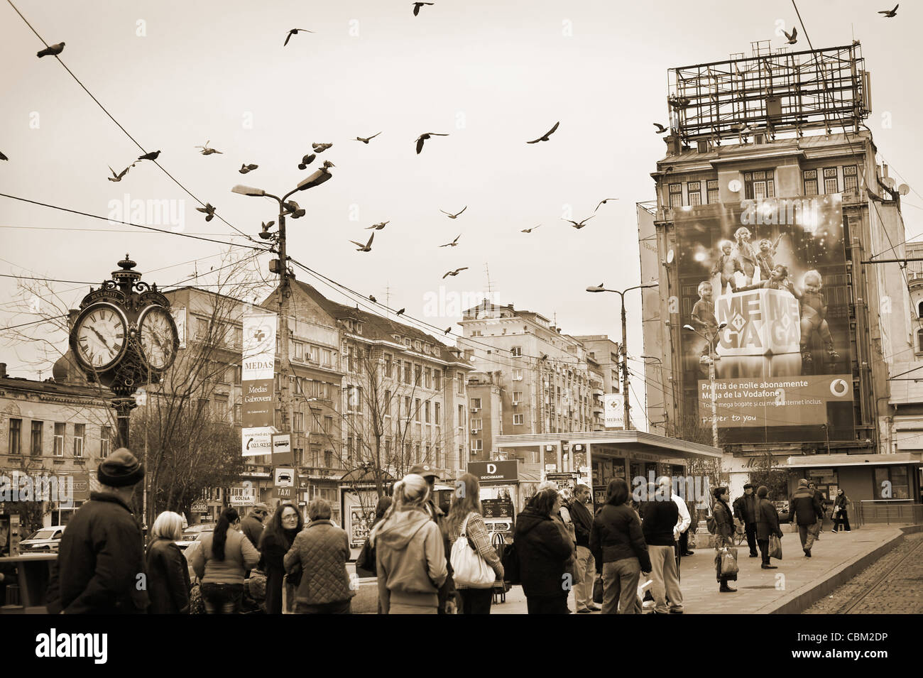 People waiting for a tram on a tram stop in Bucharest Stock Photo - Alamy