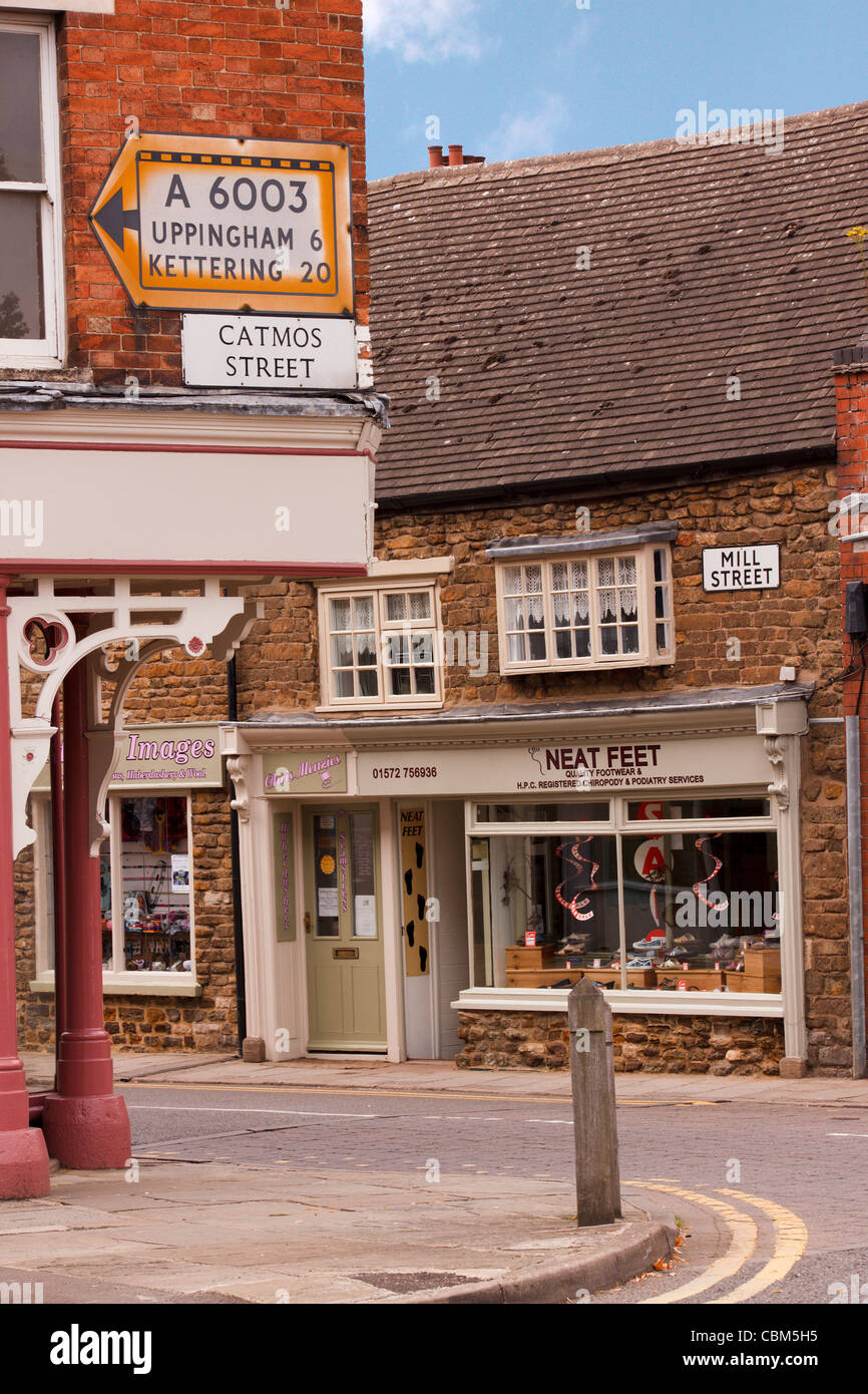 Old traditional shop fronts and road sign, Oakham, Rutland, England, UK ...