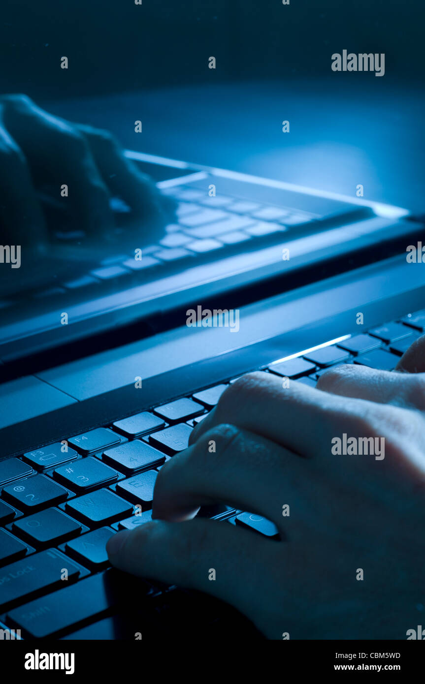 hand on keyboard with reflection in monitor Stock Photo - Alamy