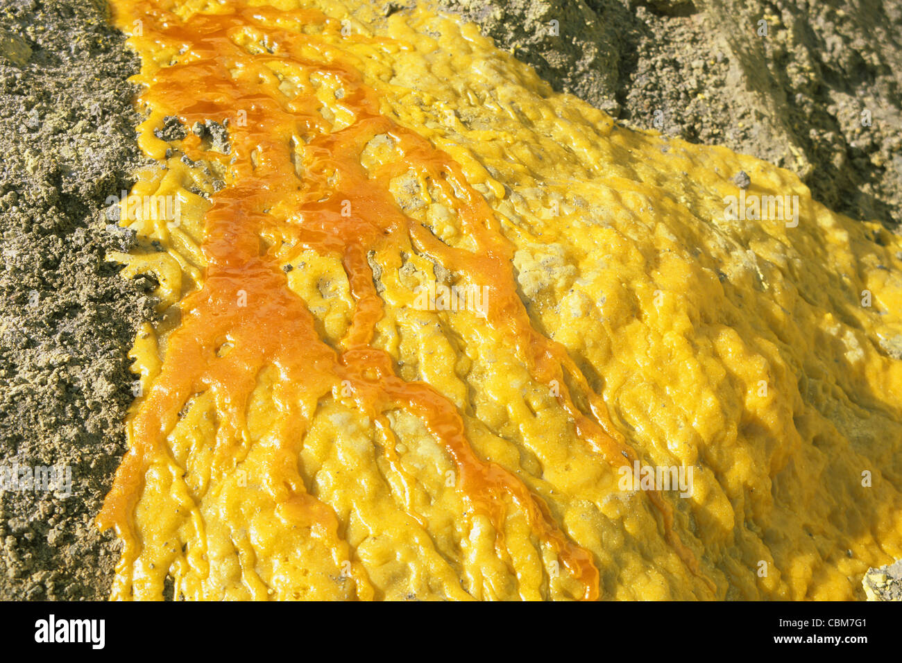Liquid sulphur flow in Kawah Ijen Volcano Sulphur Mine, Java, Indonesia ...