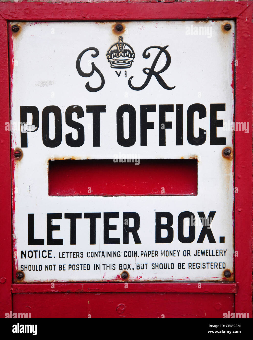 Close up of a British Royal mail Post Office George VI red letter box ...