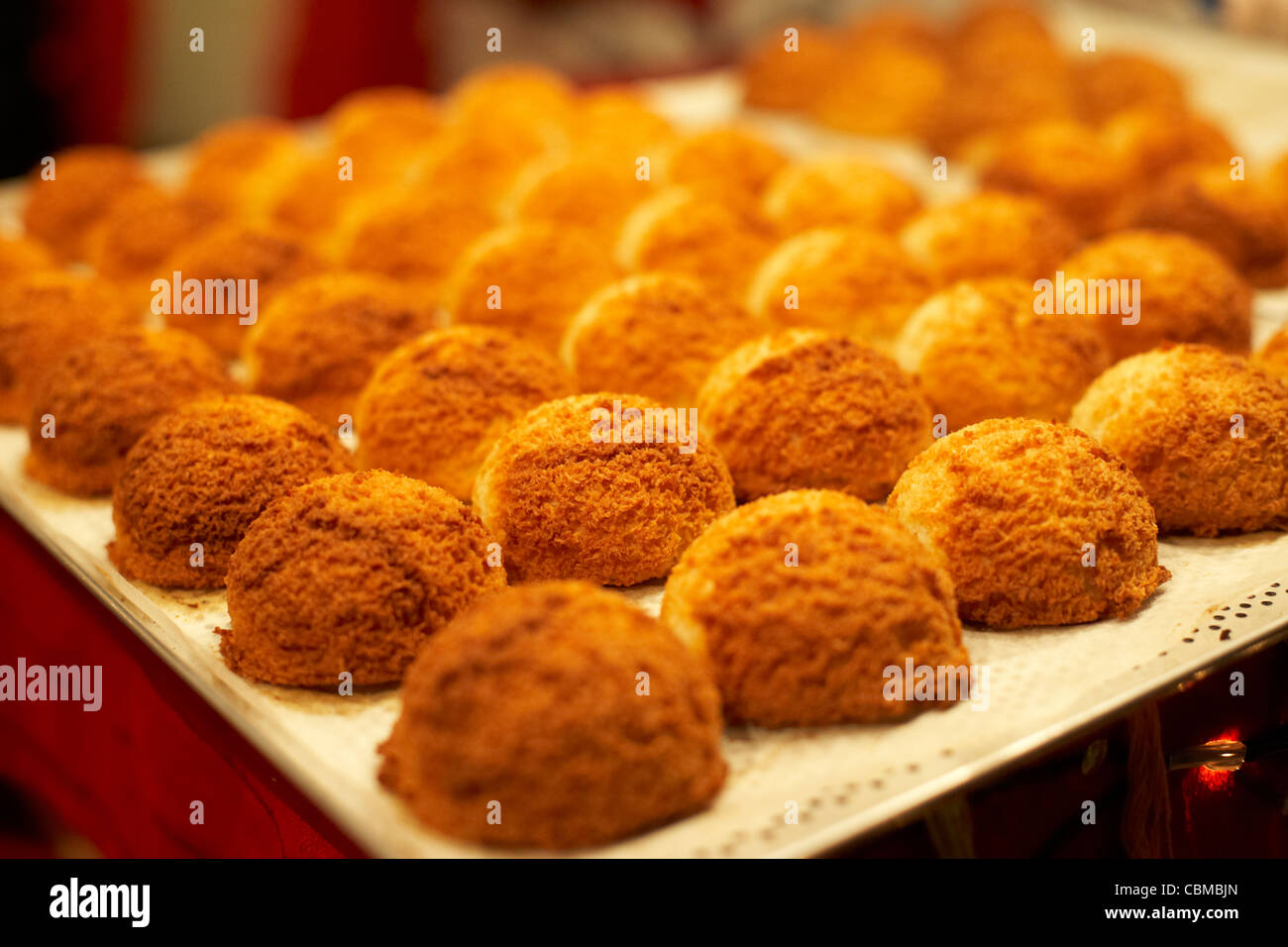 tray of freshly baked coconut macaroons on a stall in belfast northern ...